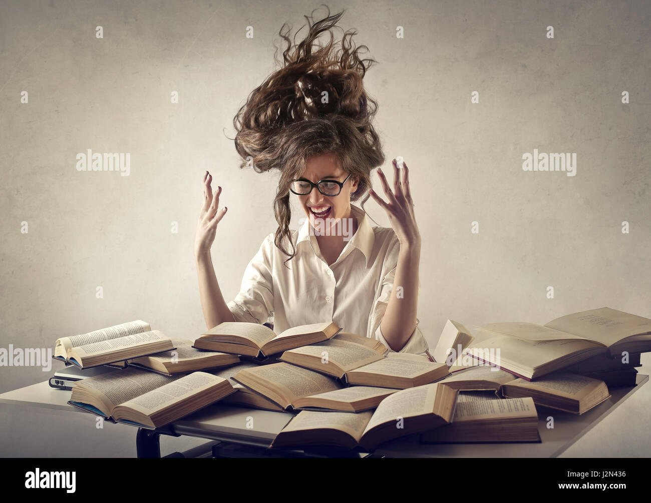 Stressed woman learning Stock Photo - Alamy