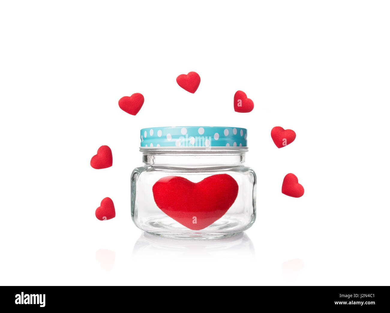 valentine and love theme, big red felt heart in glass jar with blue ...