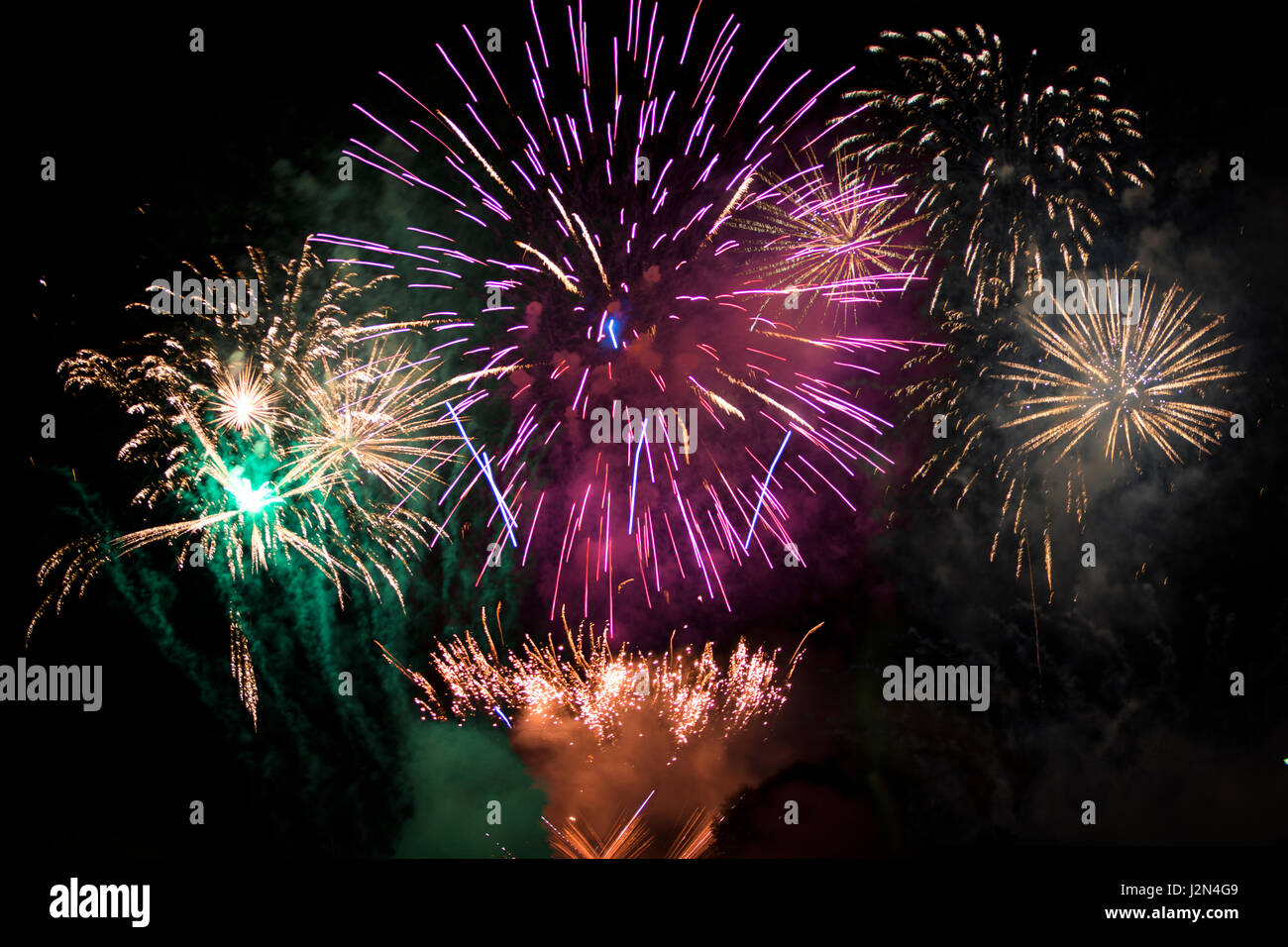 Fireworks over water Stock Photo - Alamy