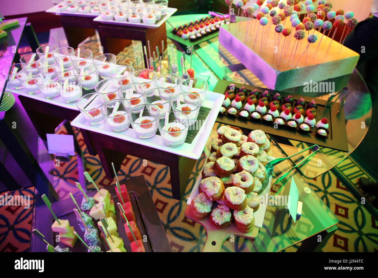 Variety of colorful modern french sweet desserts different fillings in ...