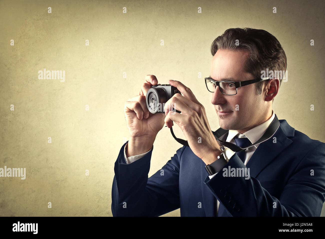 Elegant man professional camera hi-res stock photography and images - Alamy