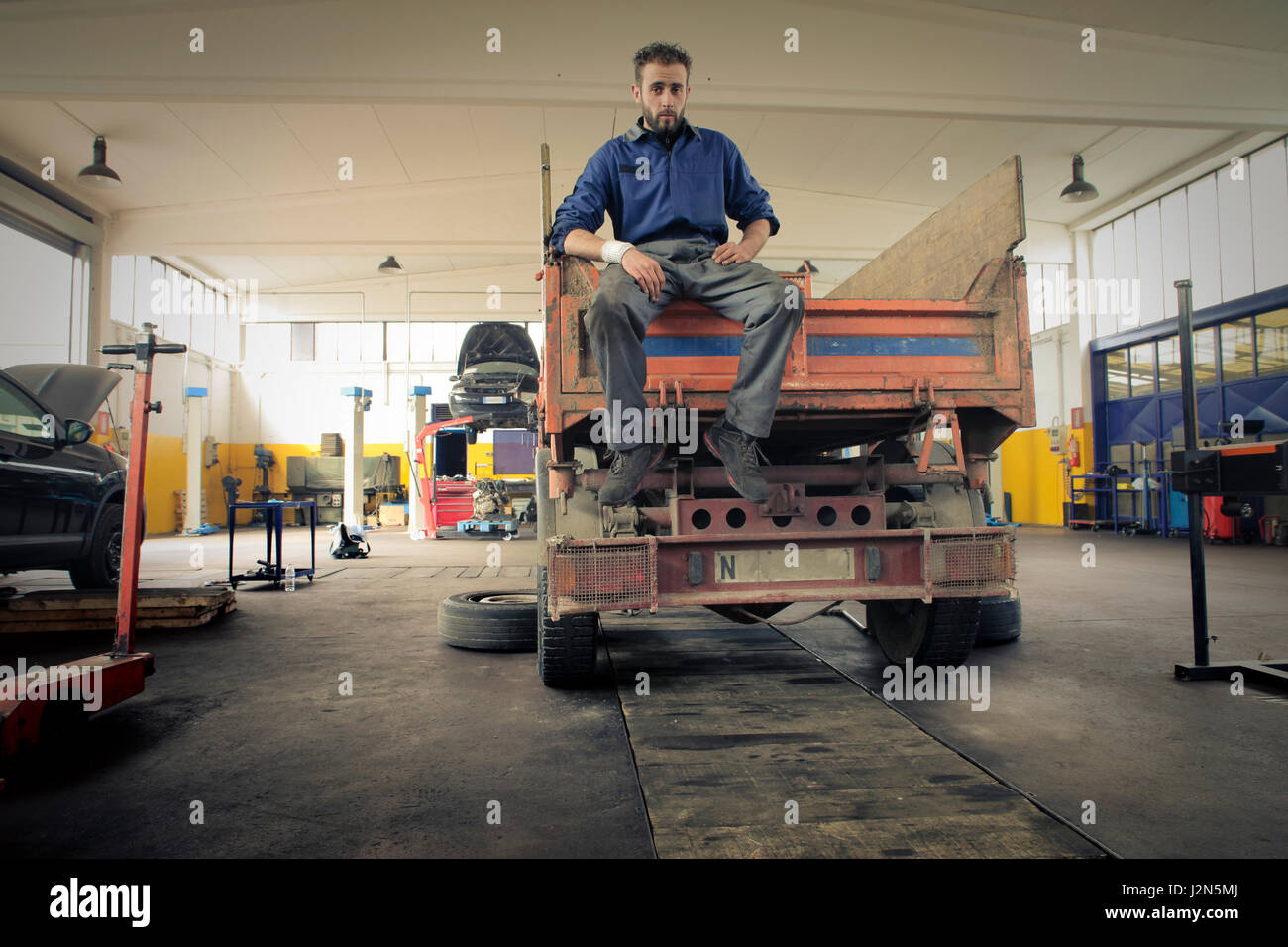 Mechanic man at work Stock Photo - Alamy