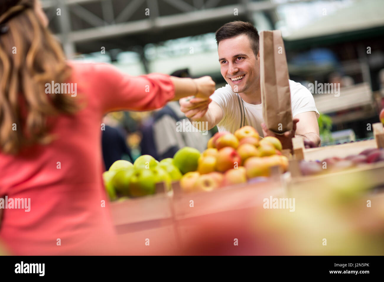 customer pay salesman produce Stock Photo - Alamy
