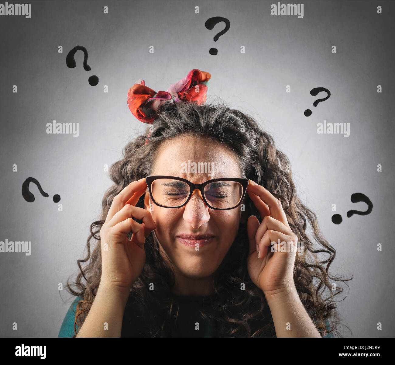 Stressed woman with questions Stock Photo - Alamy