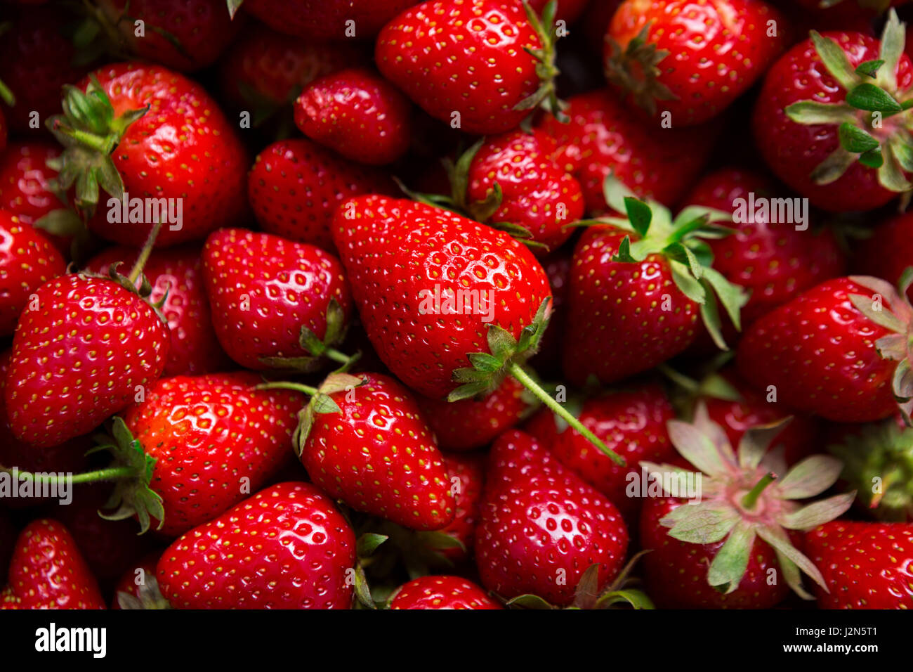 juicy red strawberry background Stock Photo - Alamy