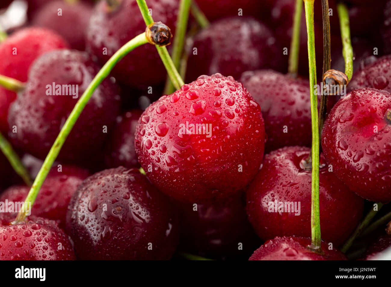 juicy red cherry close up background Stock Photo - Alamy