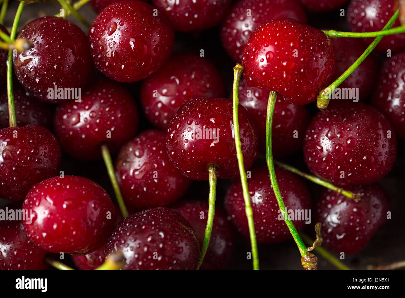 Cherry background, picking cherries Stock Photo - Alamy