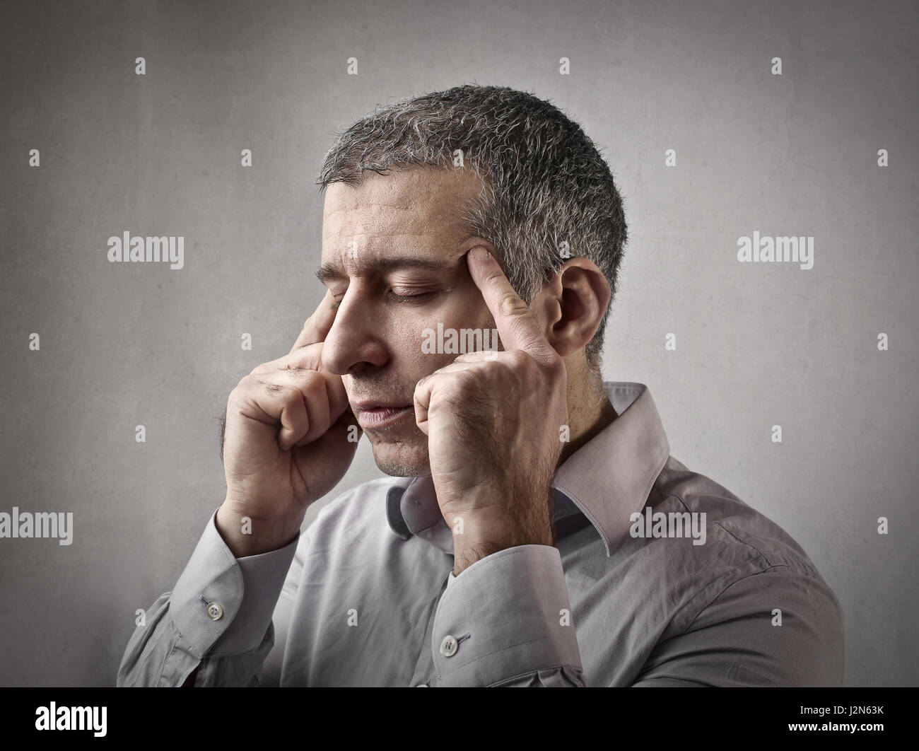 Man with headache Stock Photo - Alamy