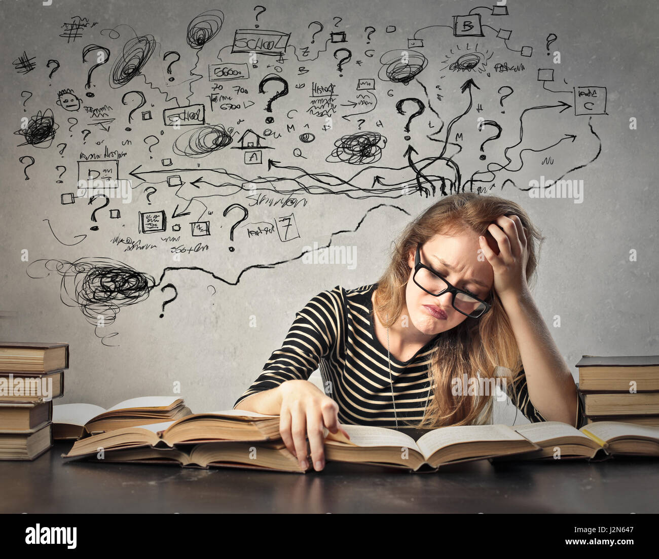 Confused woman studying inside Stock Photo - Alamy