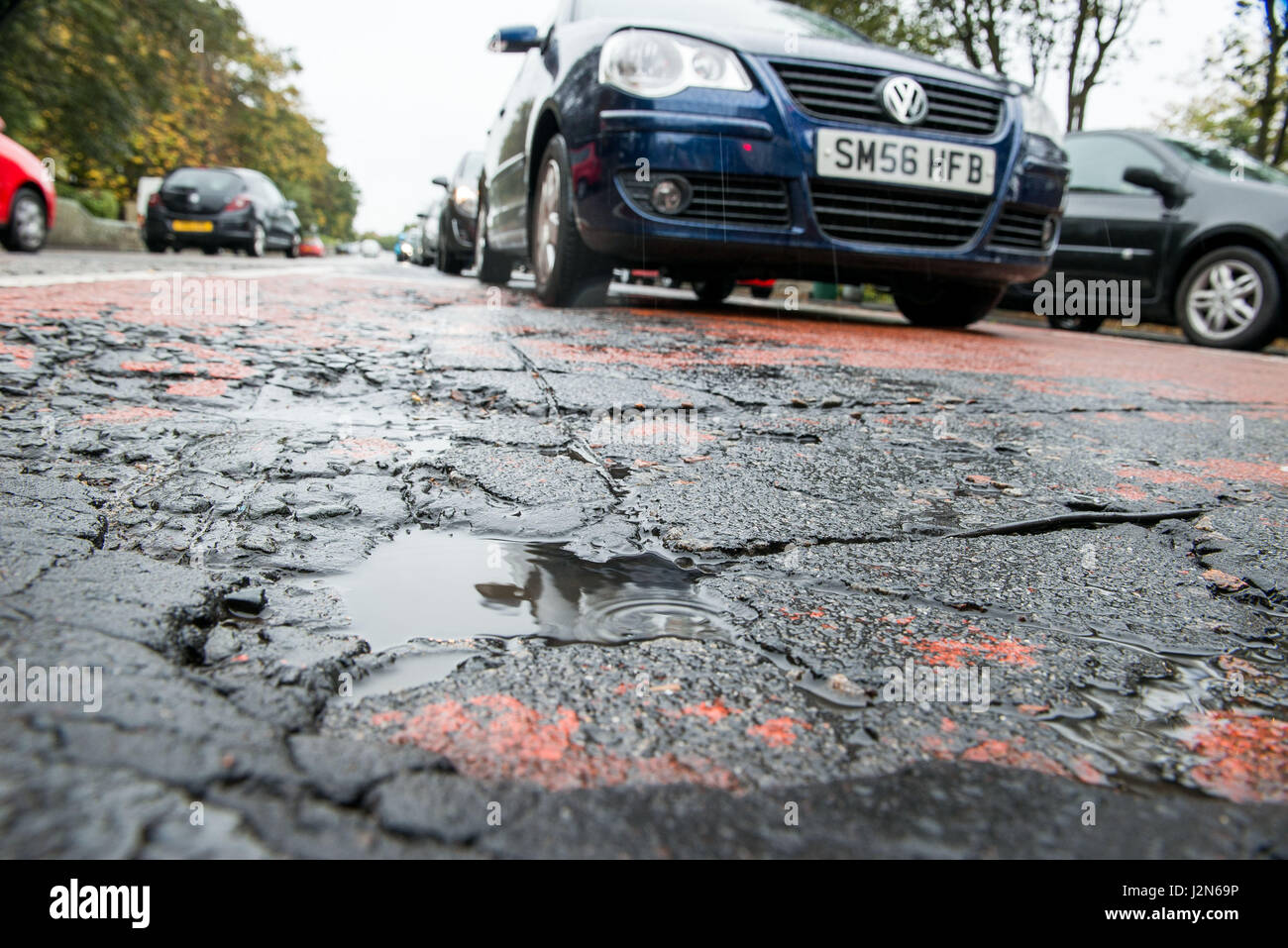 Tarmac roads with potholes hi-res stock photography and images - Alamy