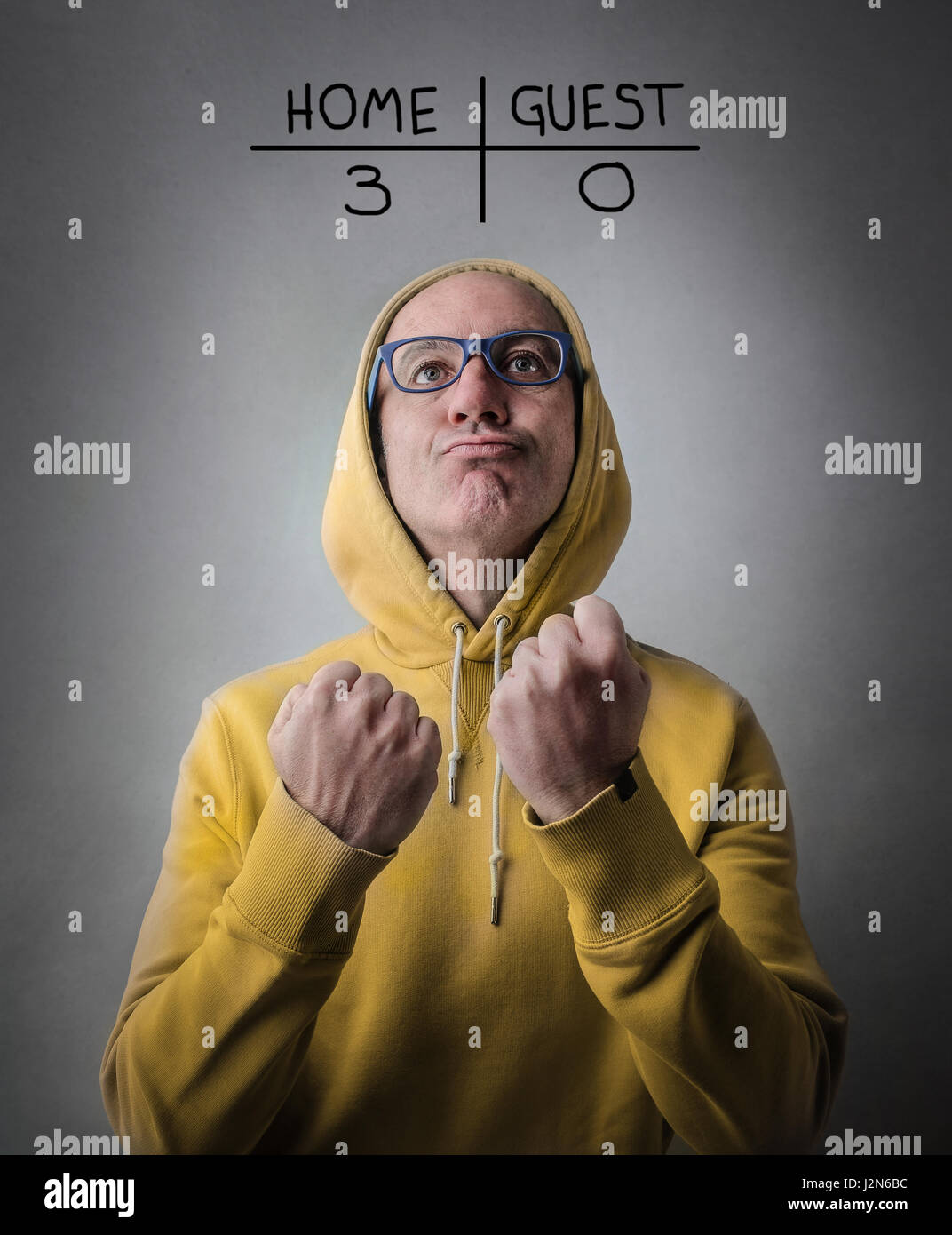 Supporter man being happy Stock Photo - Alamy