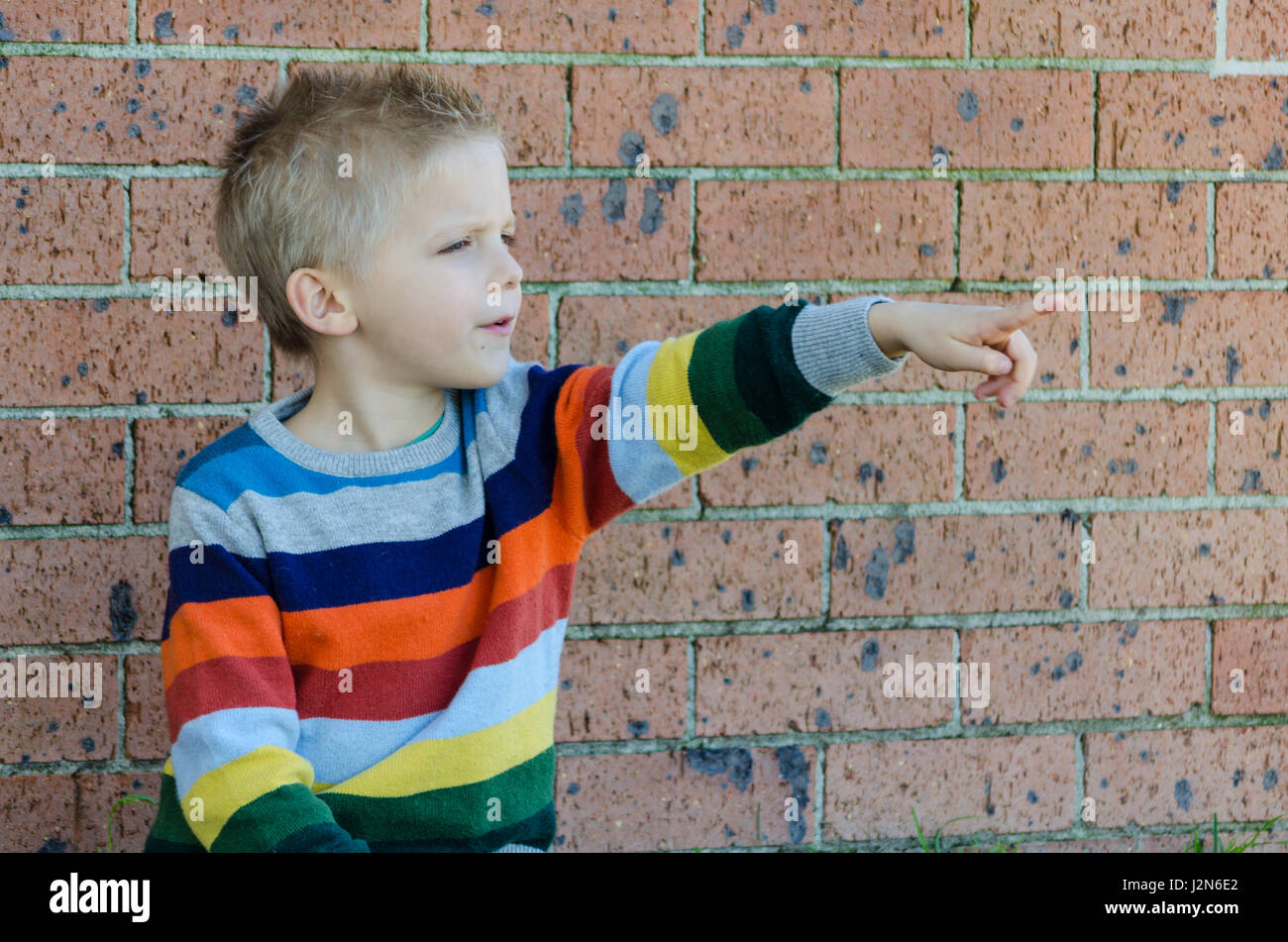 Boy pointing hand hi-res stock photography and images - Alamy