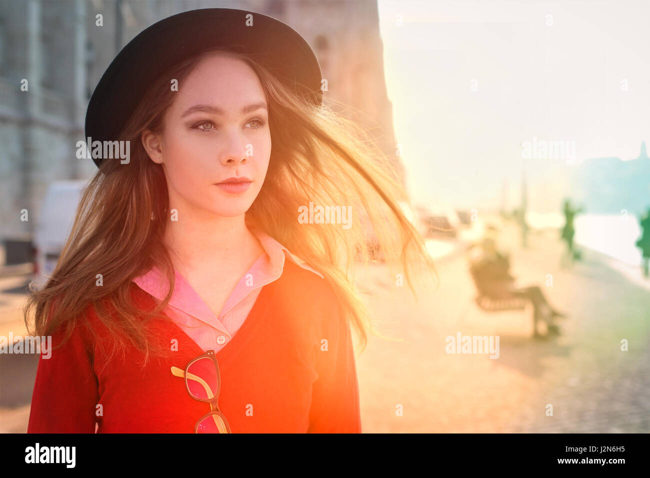Woman look city sunset view hi-res stock photography and images - Alamy