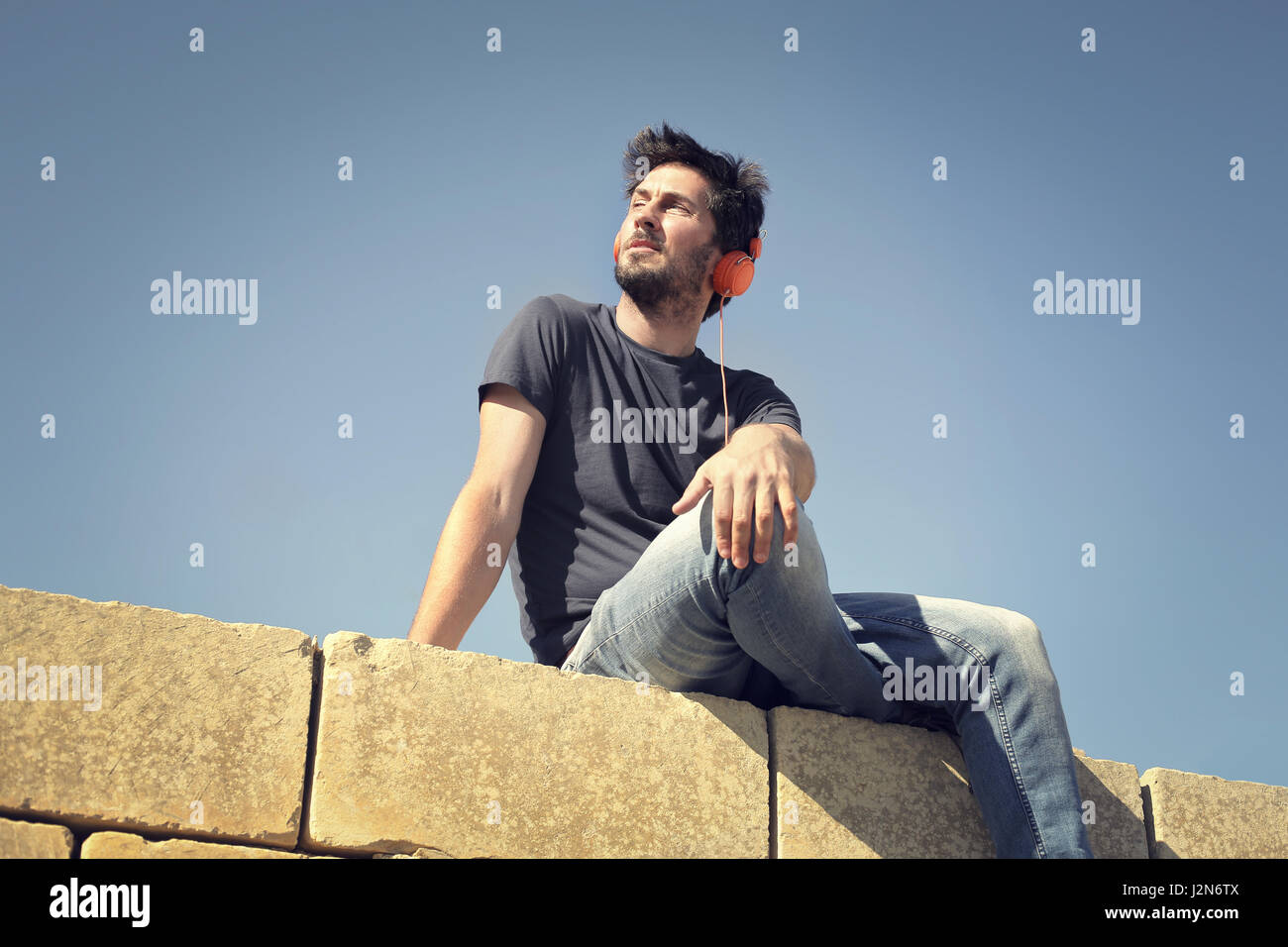 Man sitting outside Stock Photo - Alamy