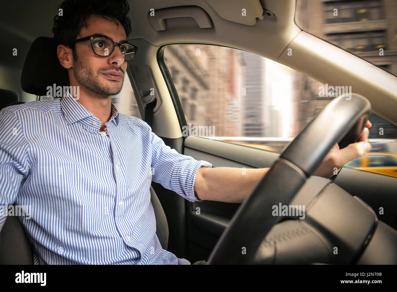 Handsome man in car Stock Photo - Alamy