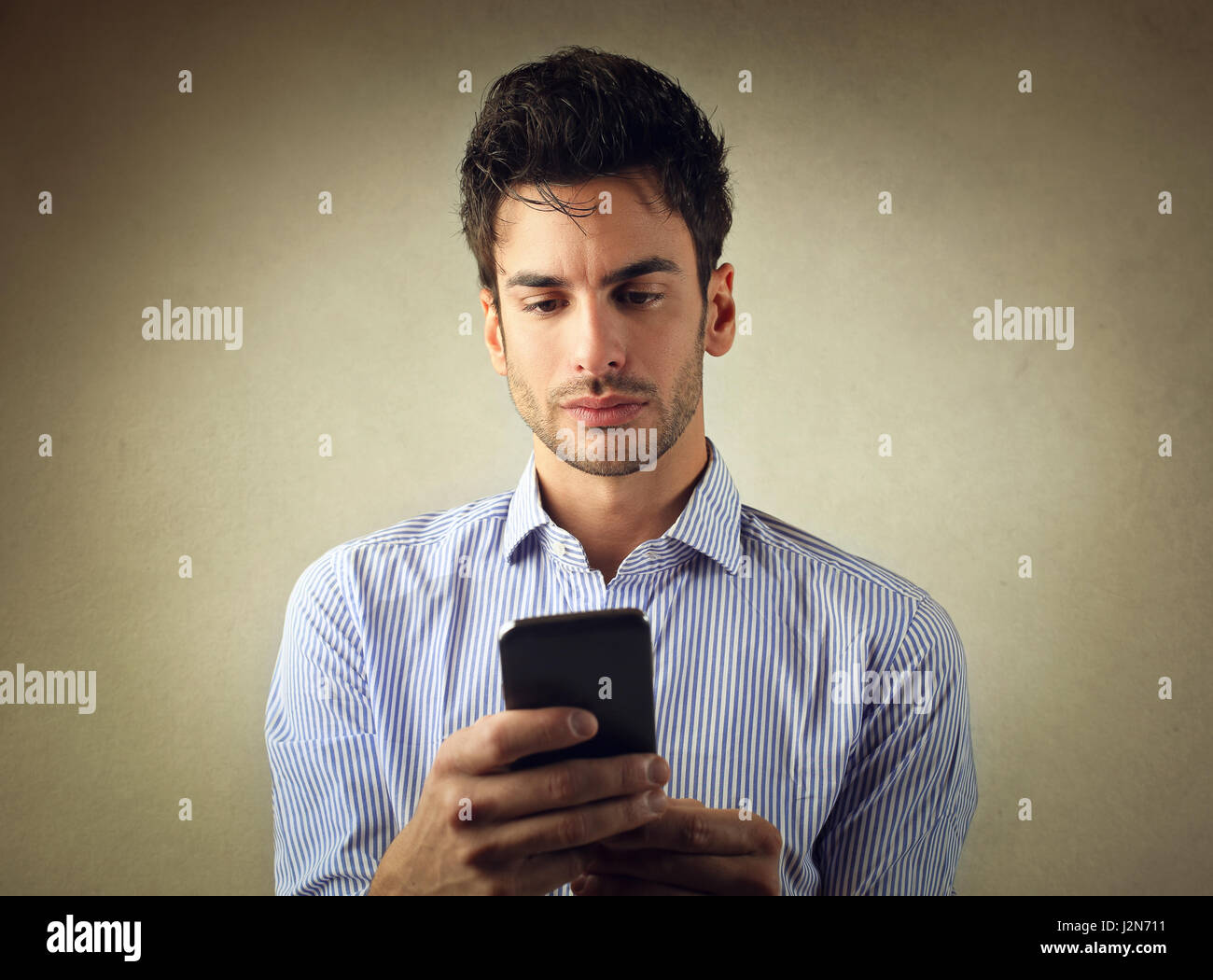 Handsome man with phone Stock Photo - Alamy