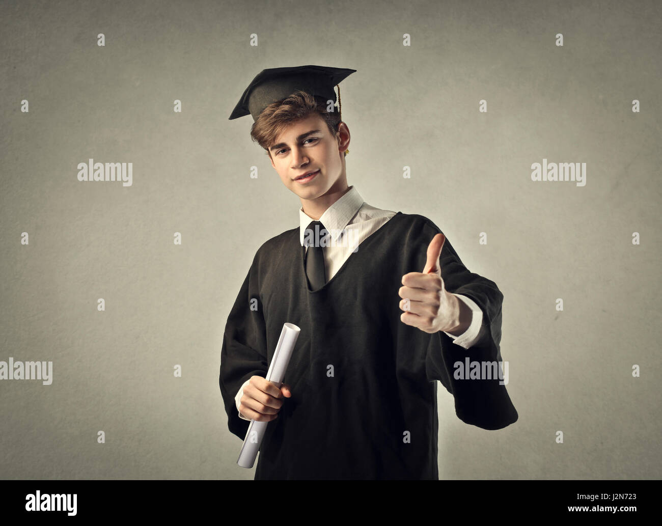 Graduating young man Stock Photo - Alamy
