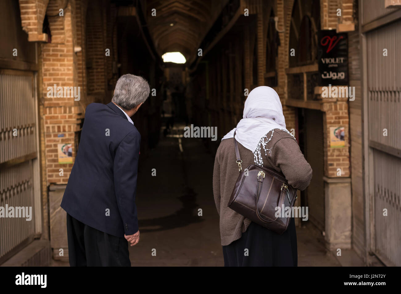 Tehran, IRAN - January 6, 2017 Back view of A Man and Woman In Front of ...