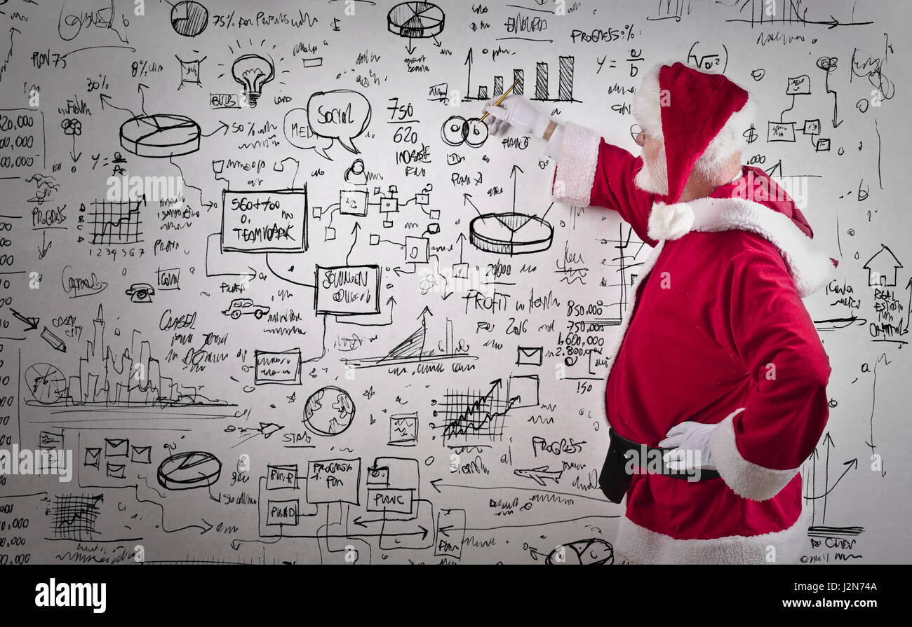 Santa Claus with business plans Stock Photo - Alamy