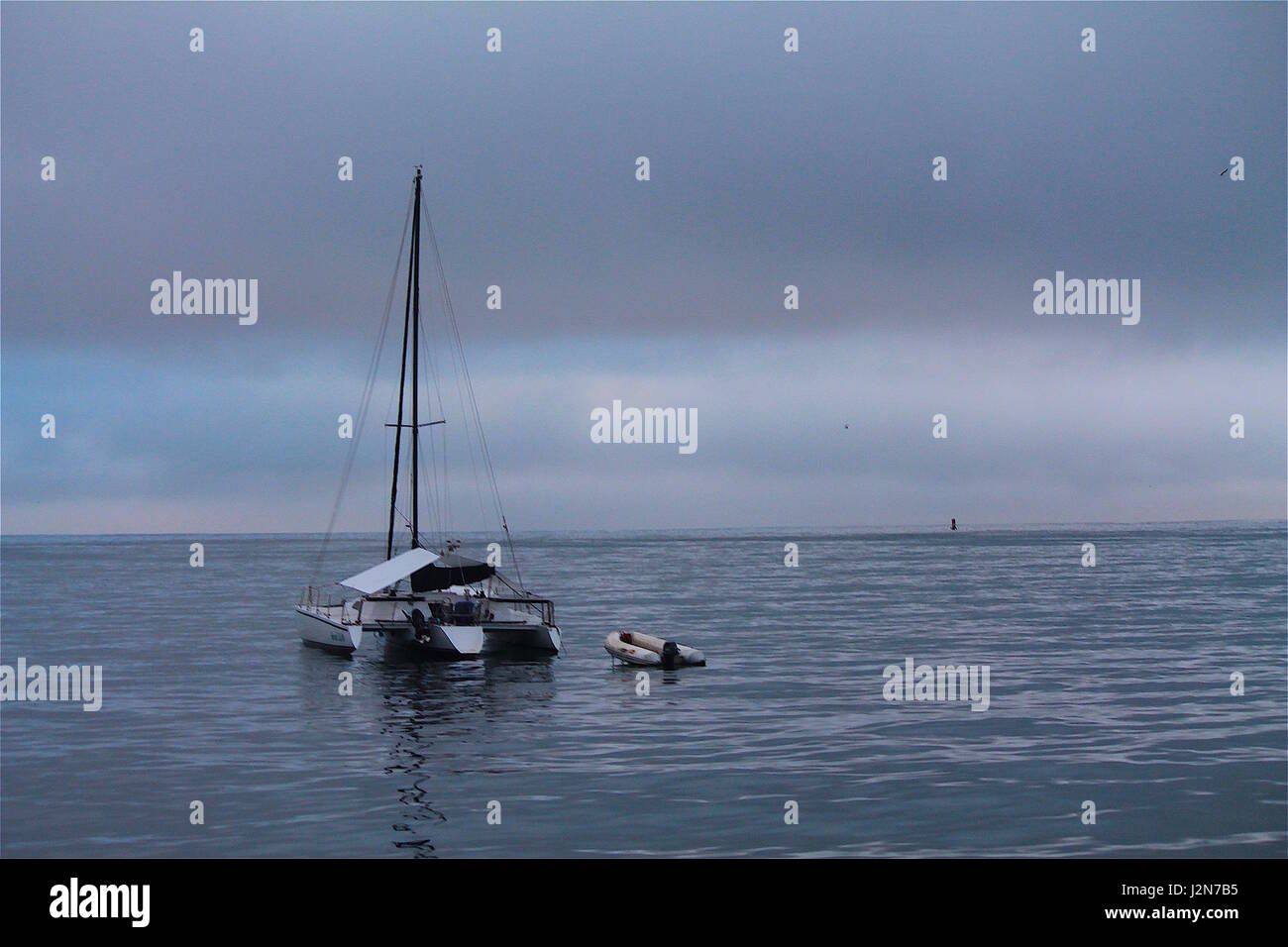 White sailboat on coast hi-res stock photography and images - Alamy