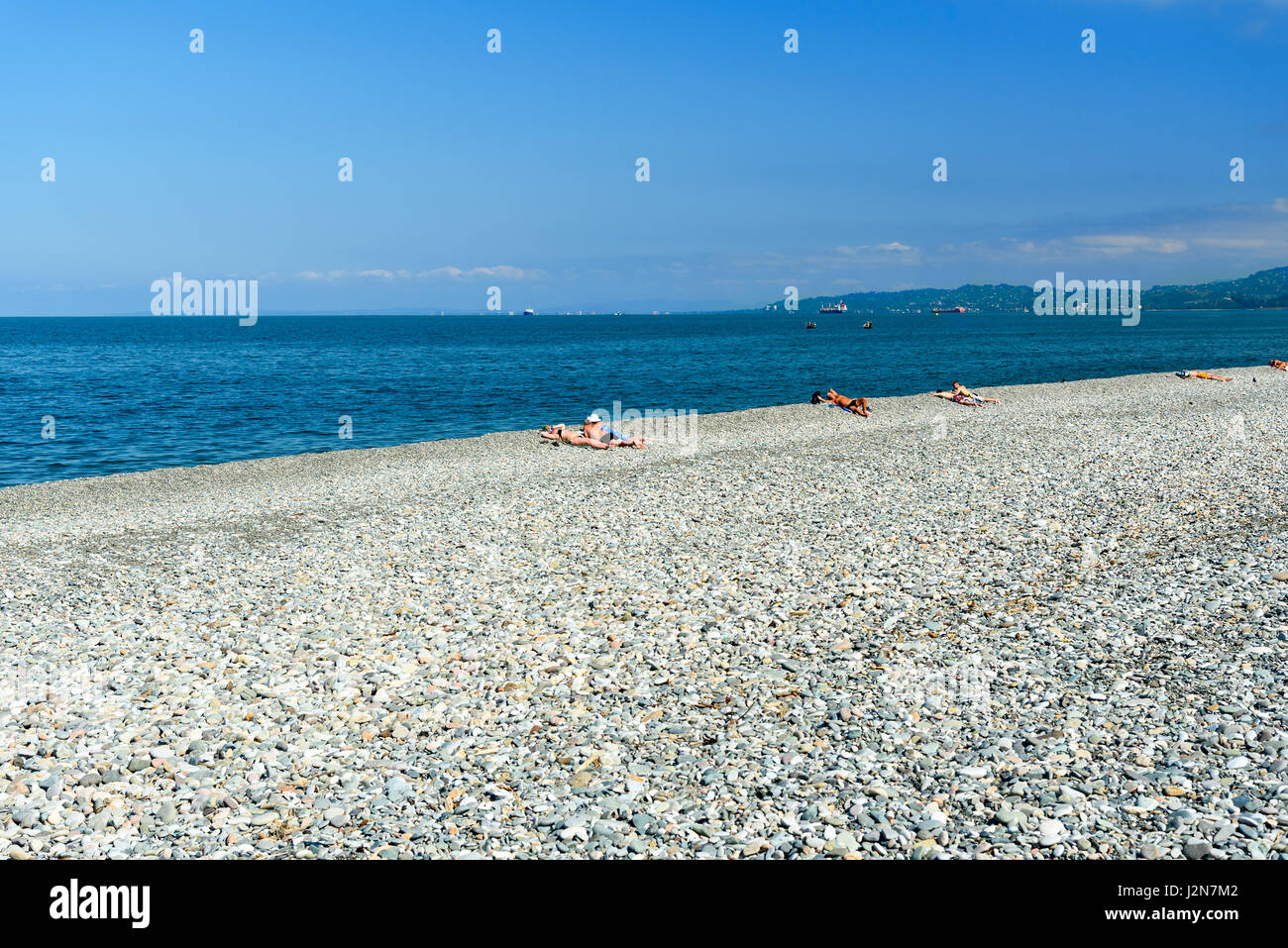 Batumi, Georgia - October 03, 2016: Long Black Sea pebble beach Stock ...