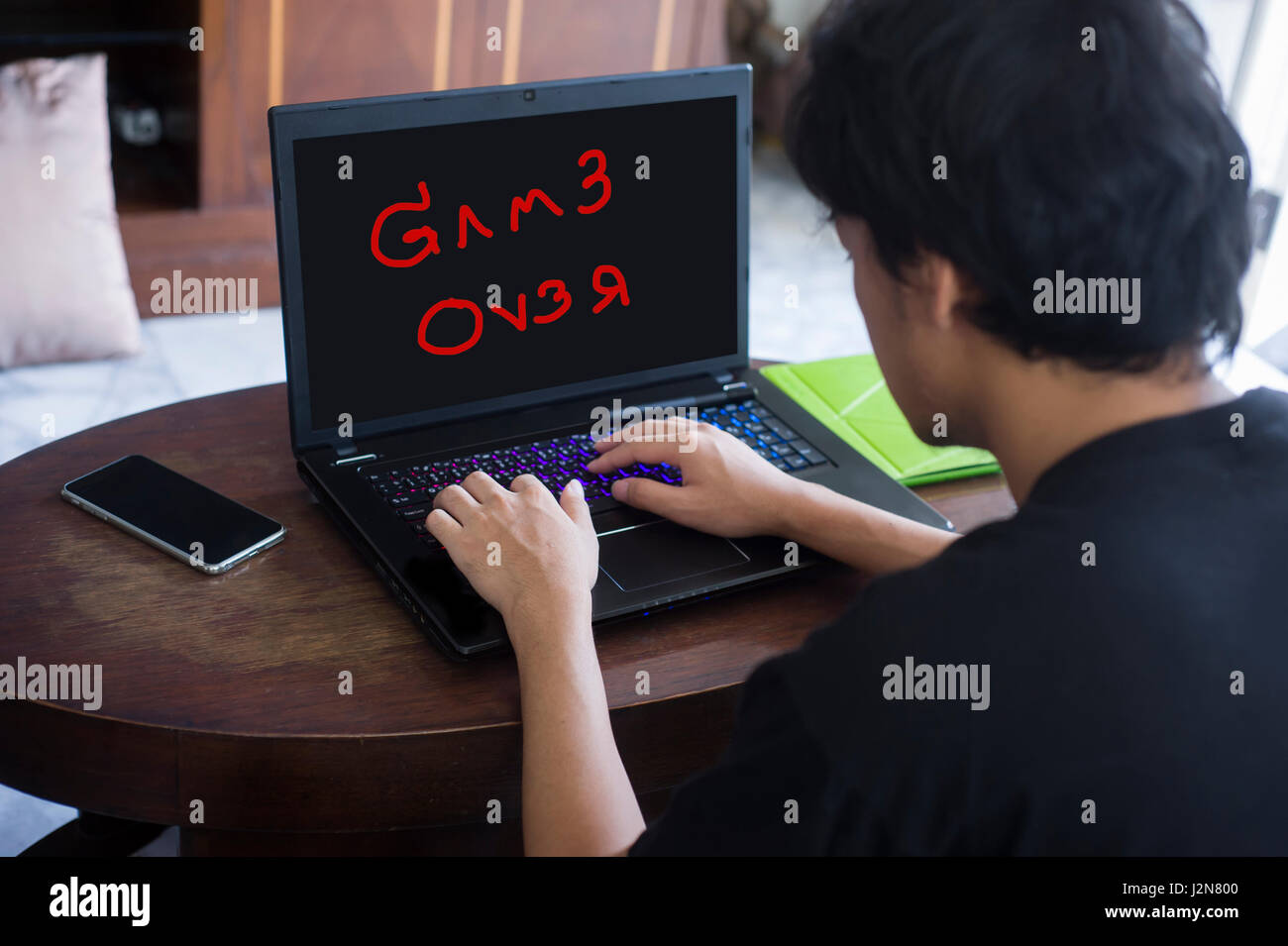 Image of blurred back head view of concentrated Asian Gamer playing ...