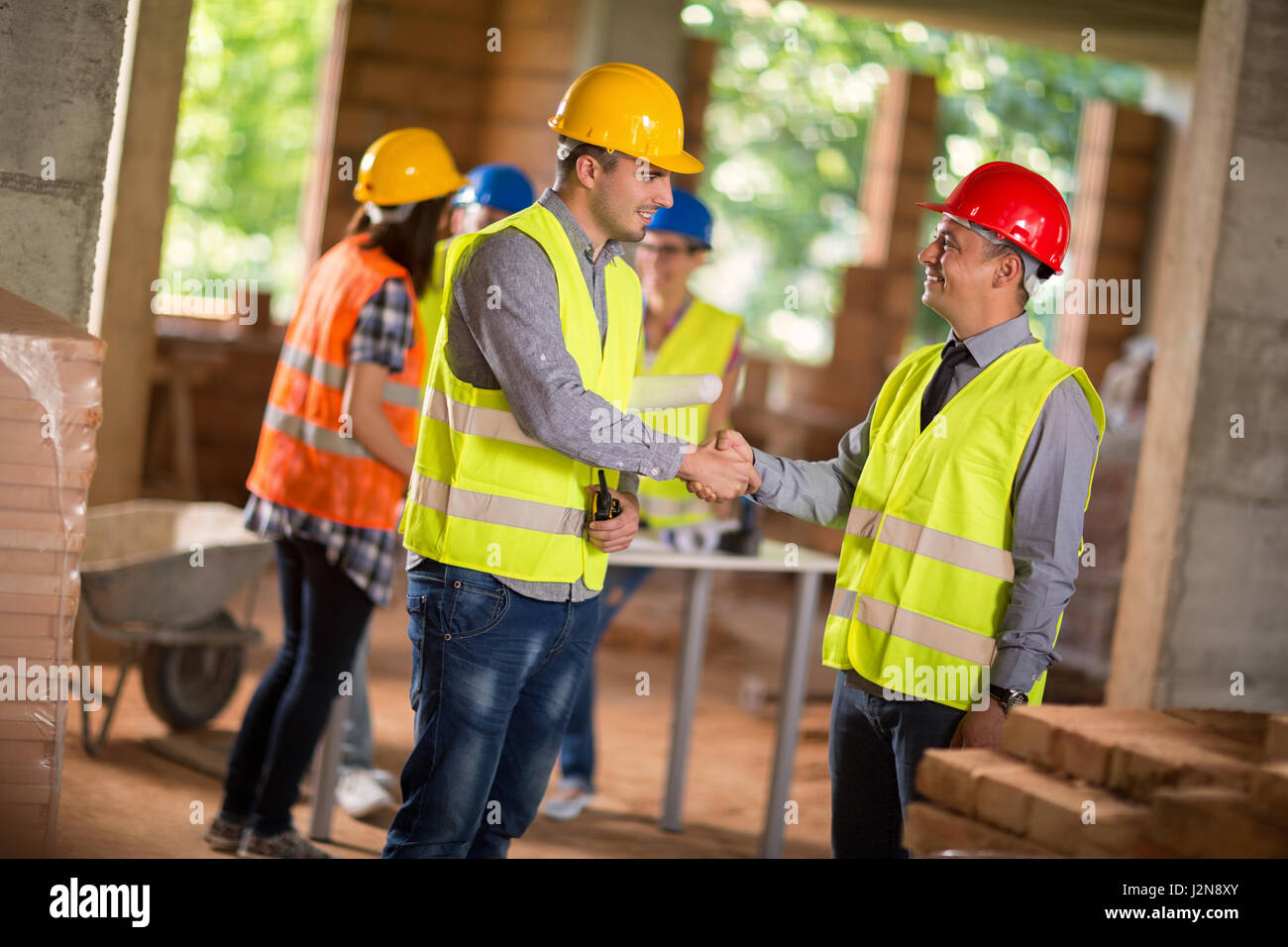 Architect and investiture of new building make deal and handshake Stock ...
