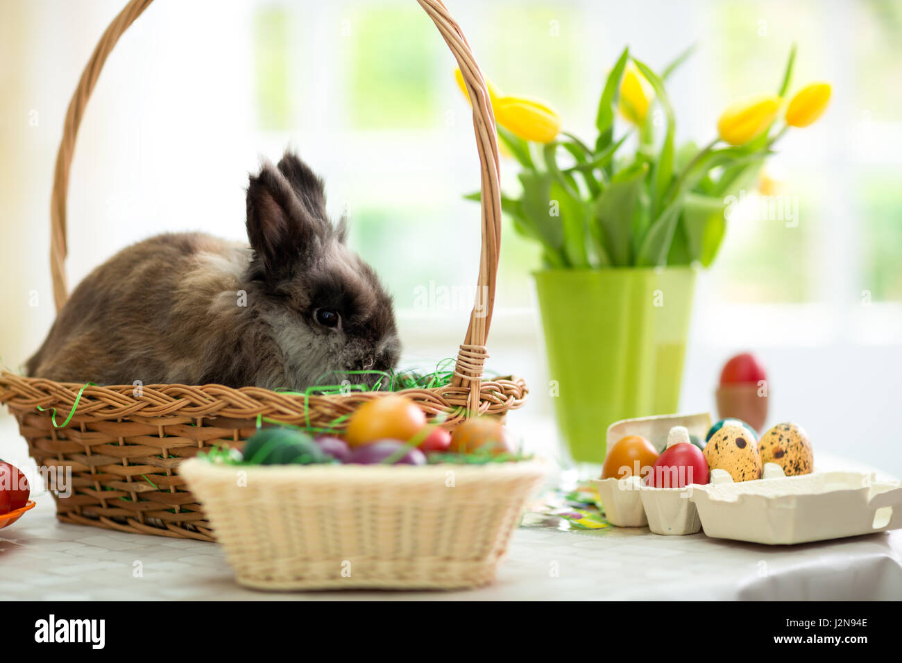Easter bunny in basket hi-res stock photography and images - Alamy