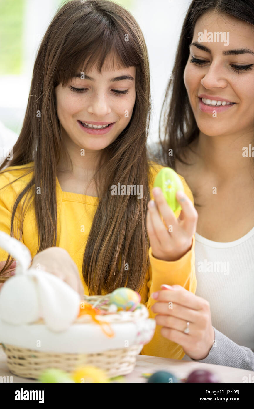 happy little girl with mother and Easter egg Stock Photo - Alamy