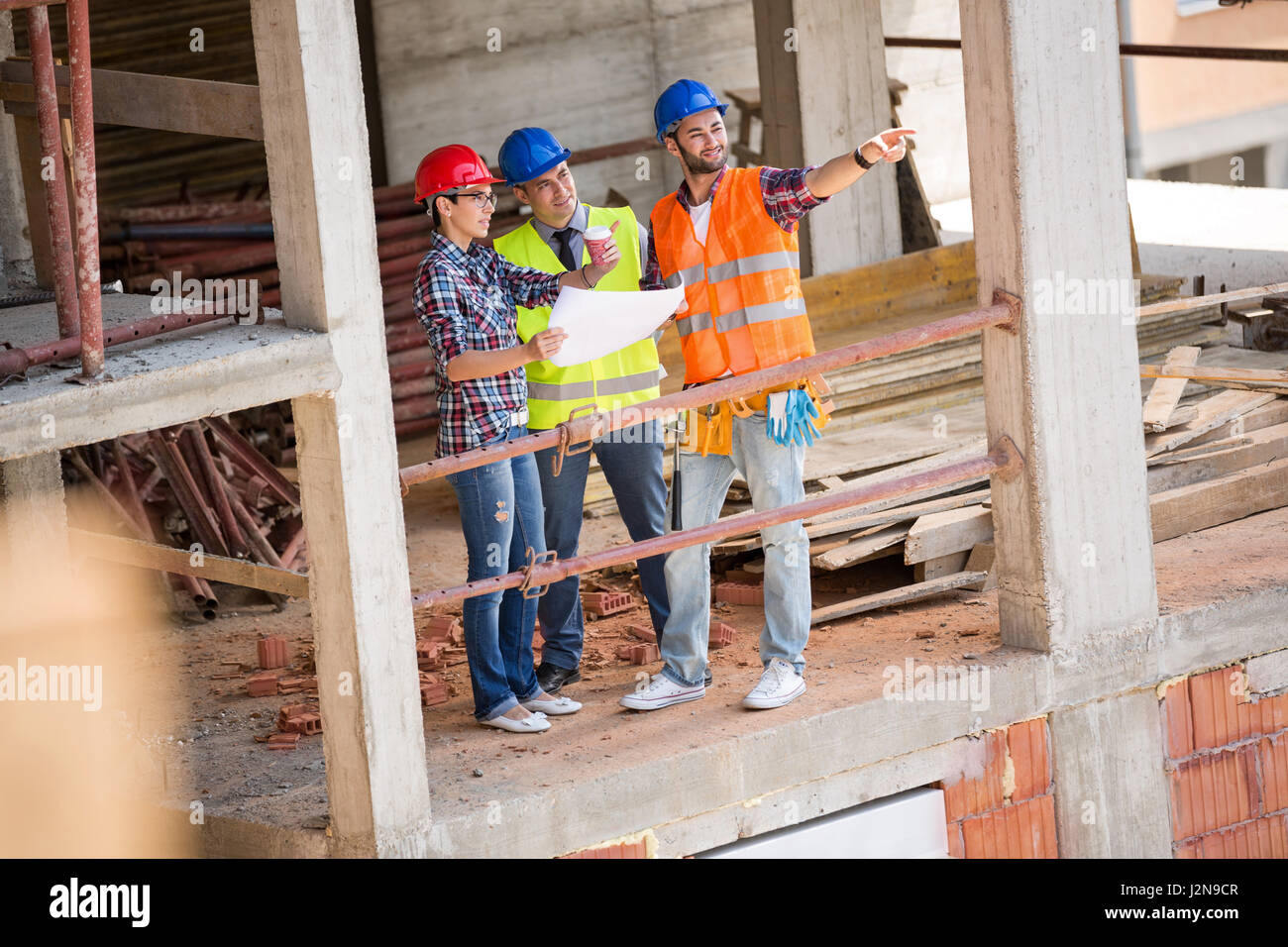 Group of building constructers discussing and Stock Photo - Alamy