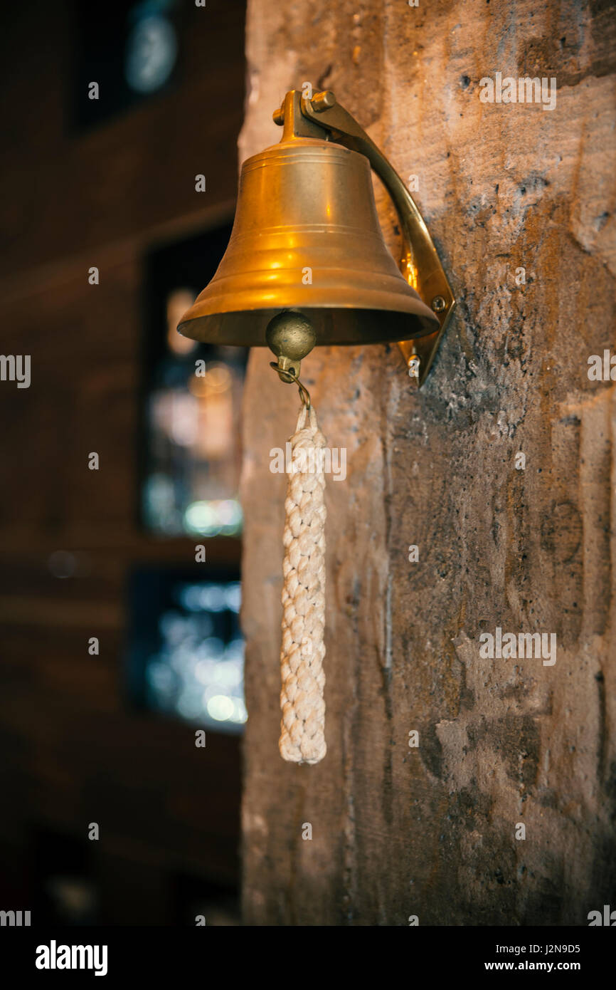 ship's bell in bar, close up Stock Photo - Alamy