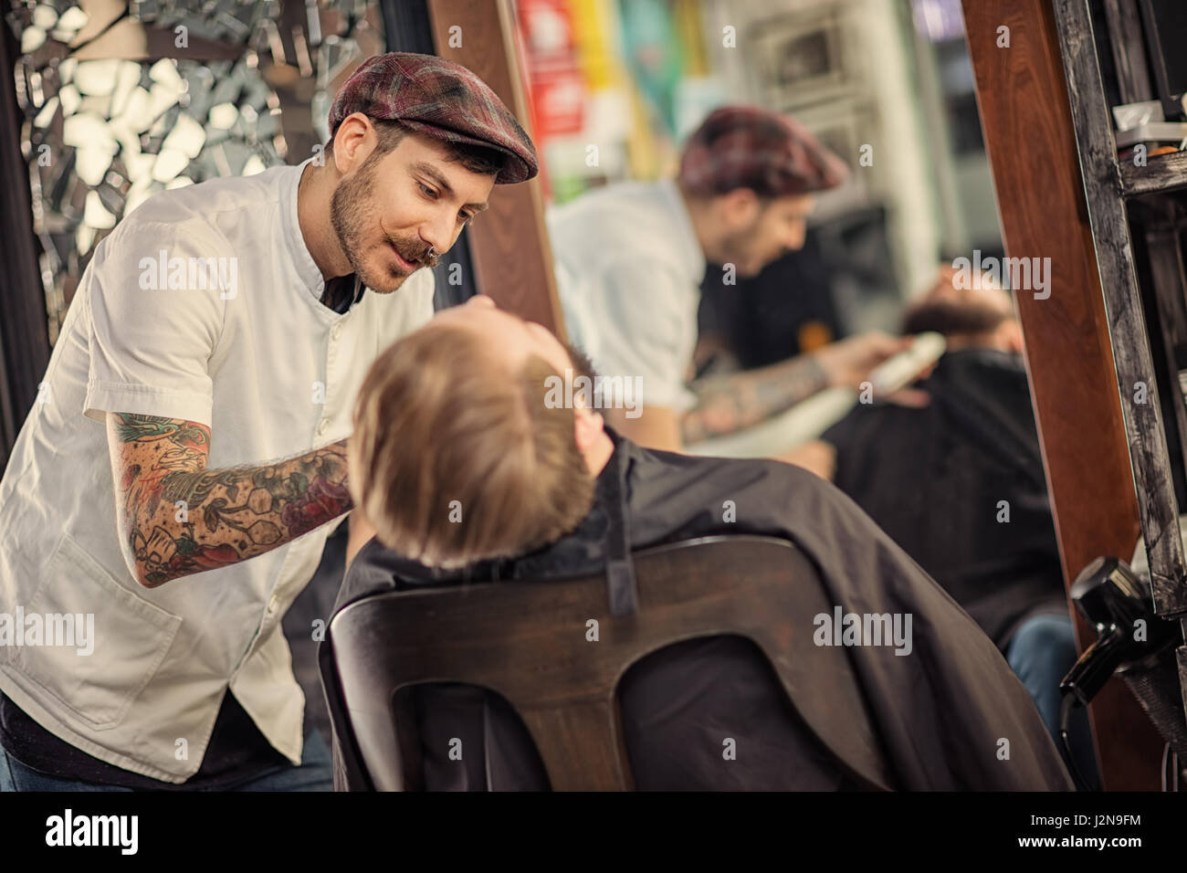 professional skillful barber shaving beard on customer Stock Photo - Alamy