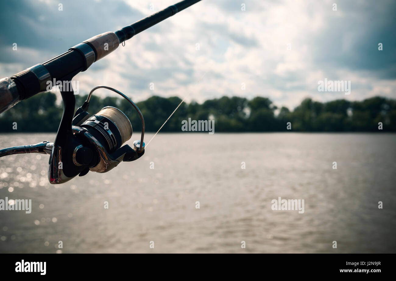 fishing rod and river, close up Stock Photo - Alamy