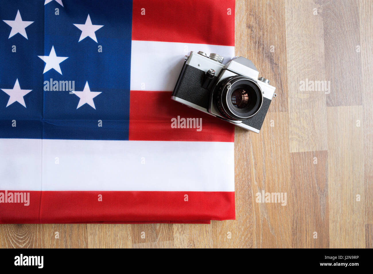 top view American flag and retro photo camera background Stock Photo ...