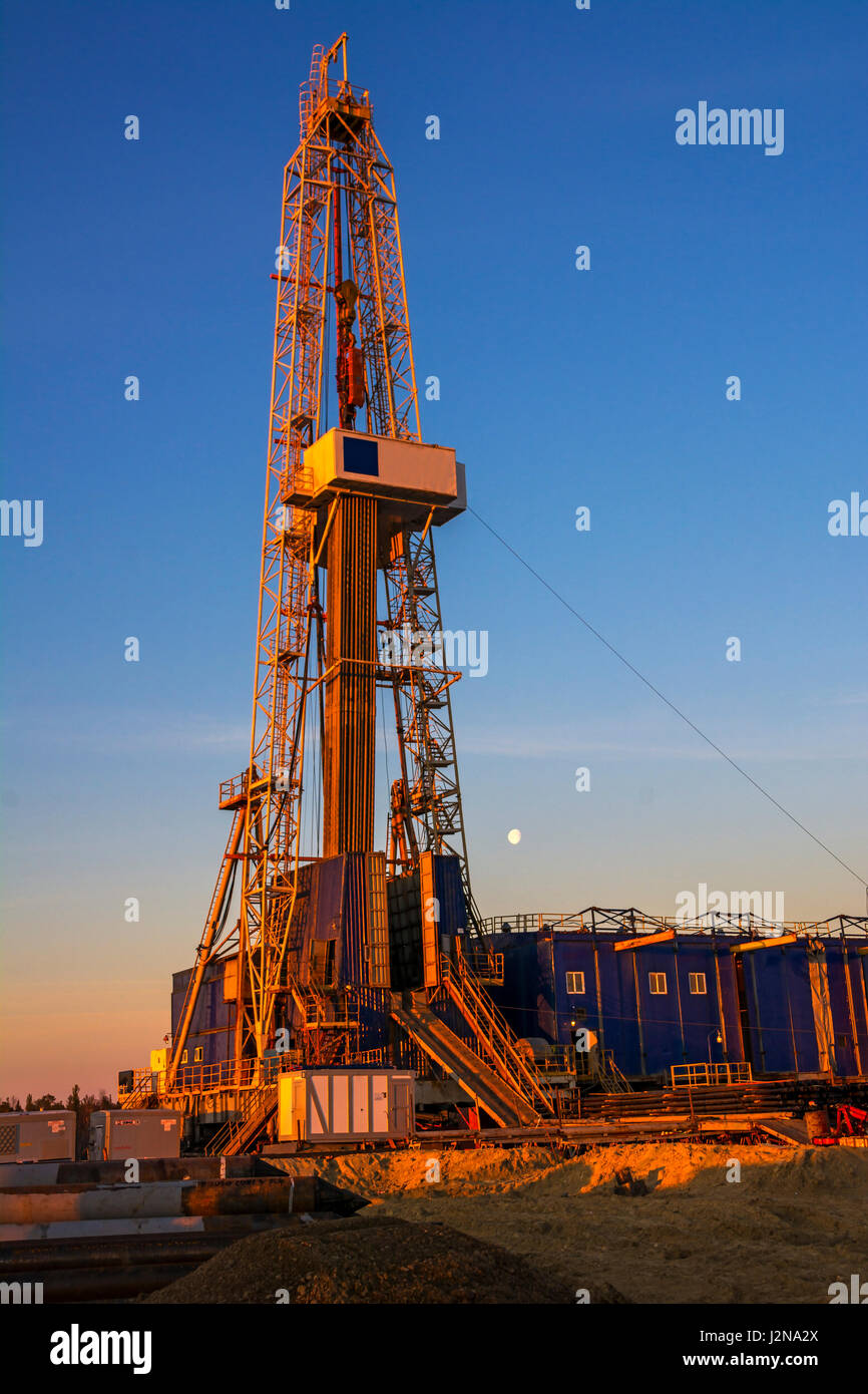 Oil rig at background dawn Stock Photo - Alamy