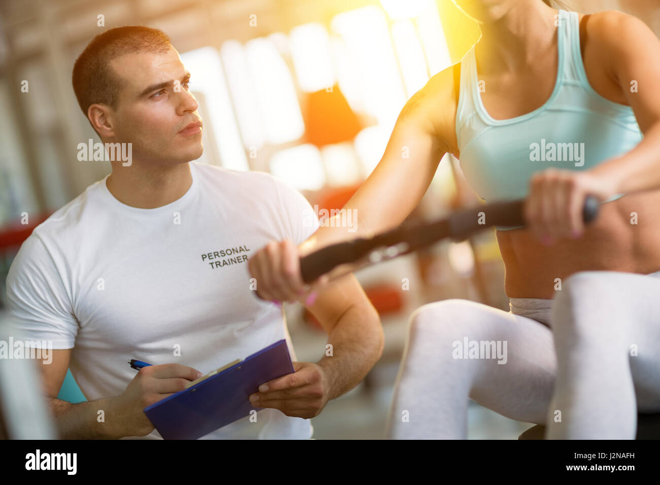 Young male personal trainer hi-res stock photography and images - Alamy