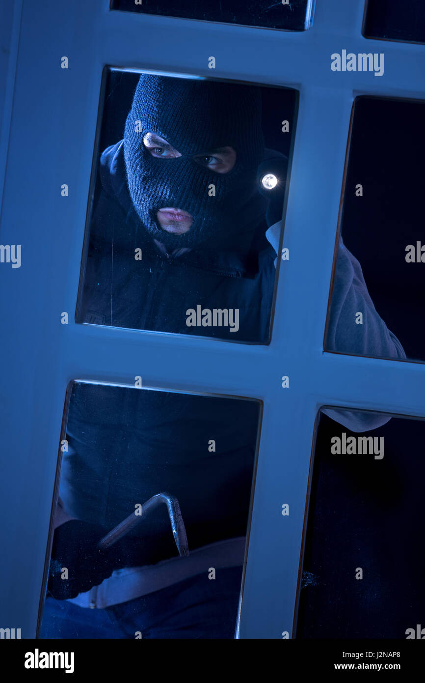 Robber shadow crowbar breaking house hi-res stock photography and ...