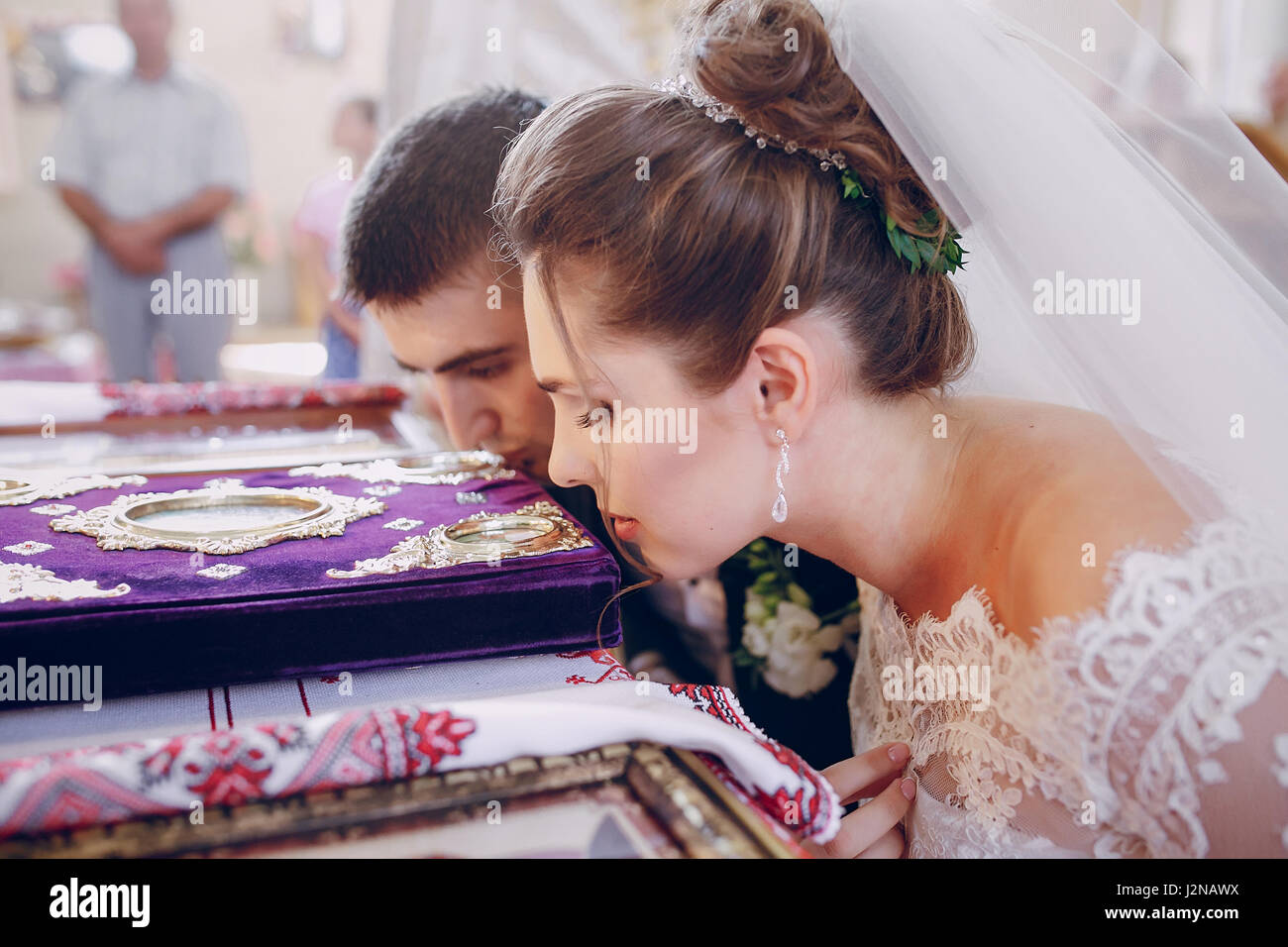 the bride and groom marry in the Church Stock Photo - Alamy