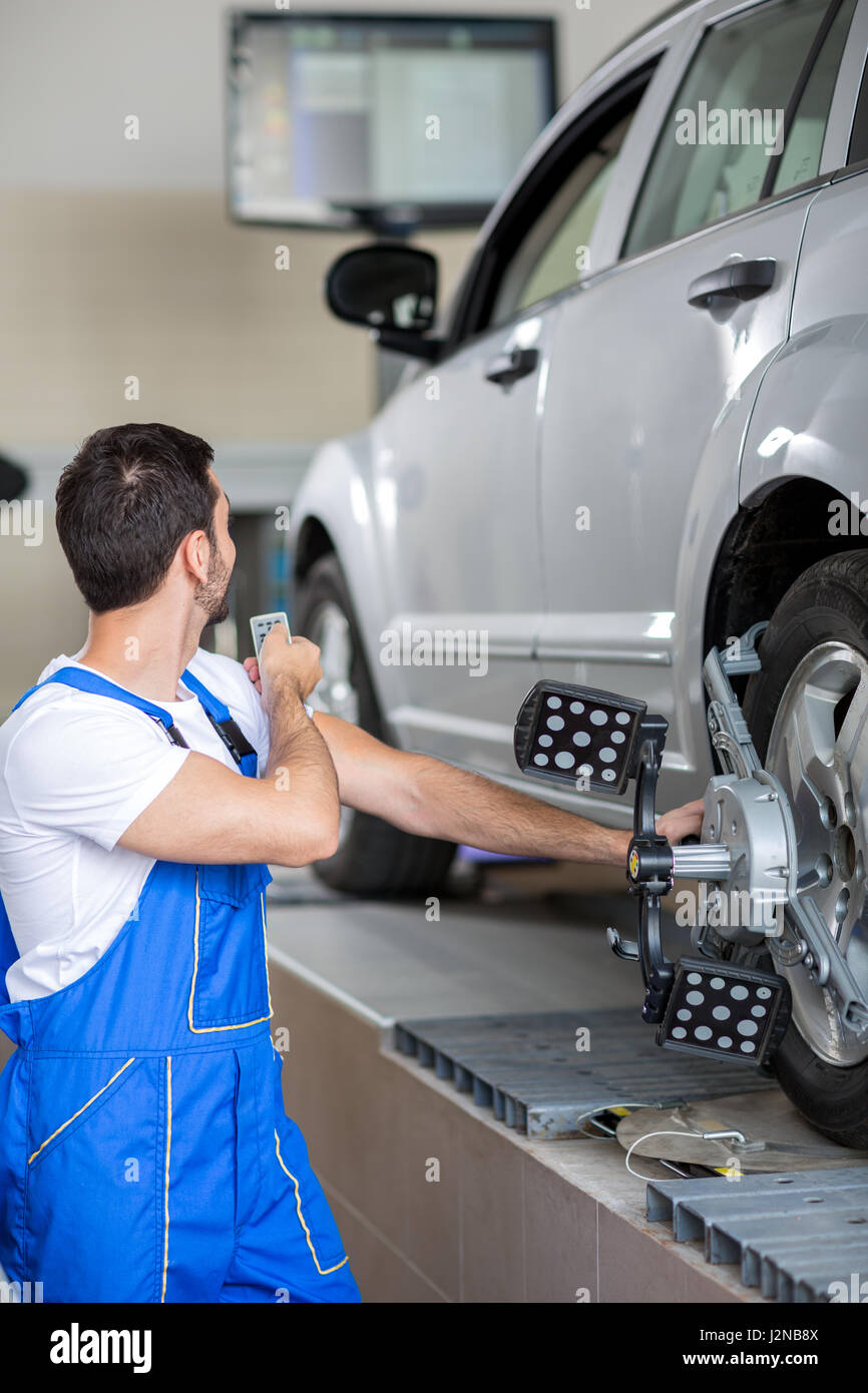Car with sensors on wheels on checking in workshop of service Stock ...