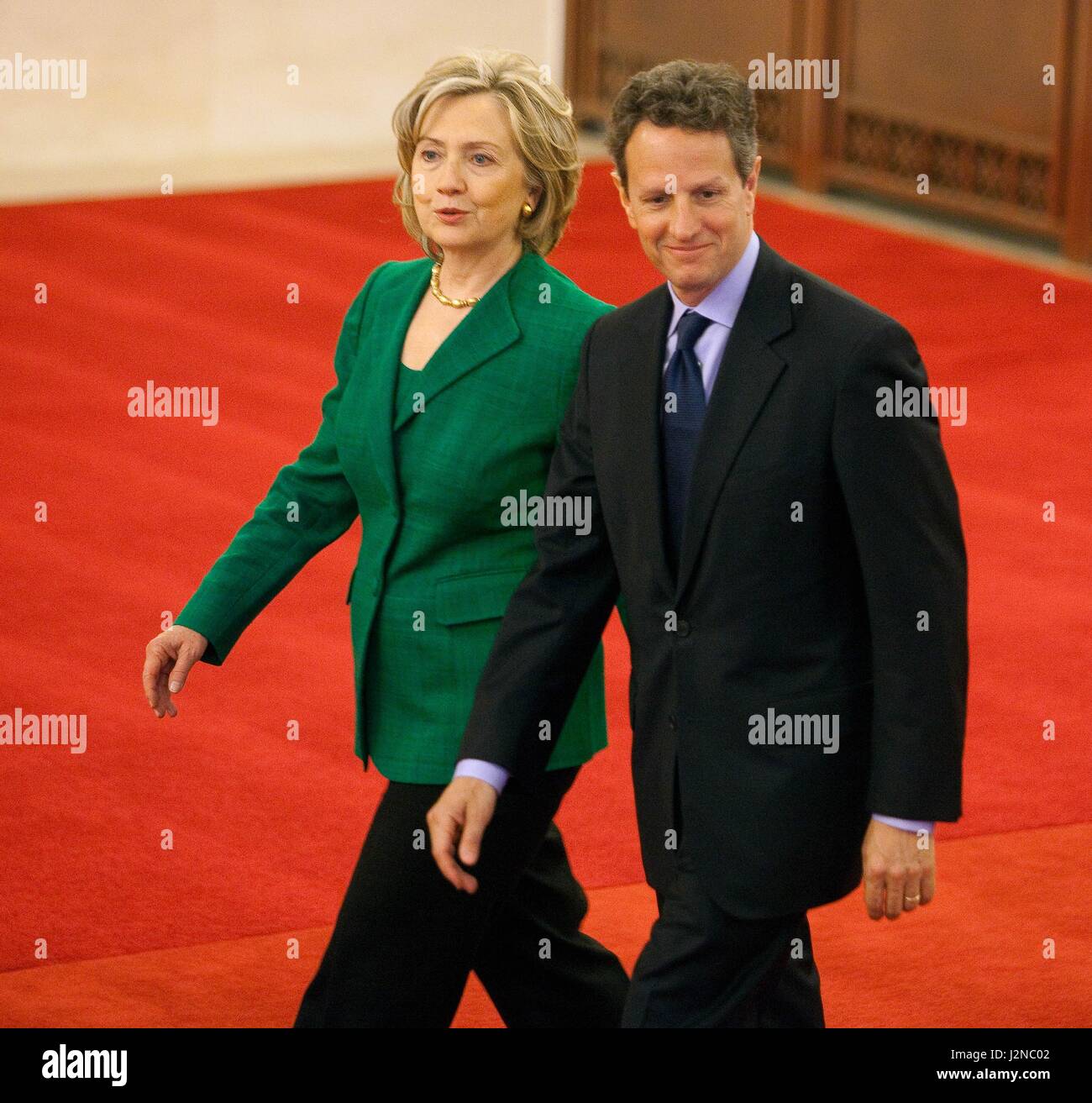 U.S Treasury Secretary Timothy Geithner walks with Secretary of State ...