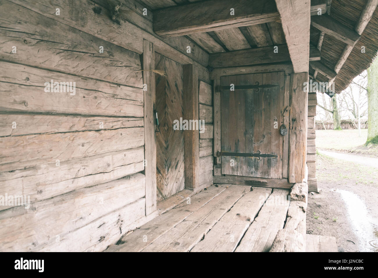 Abandoned ruins of old wooden building in latvia countryside - vintage ...
