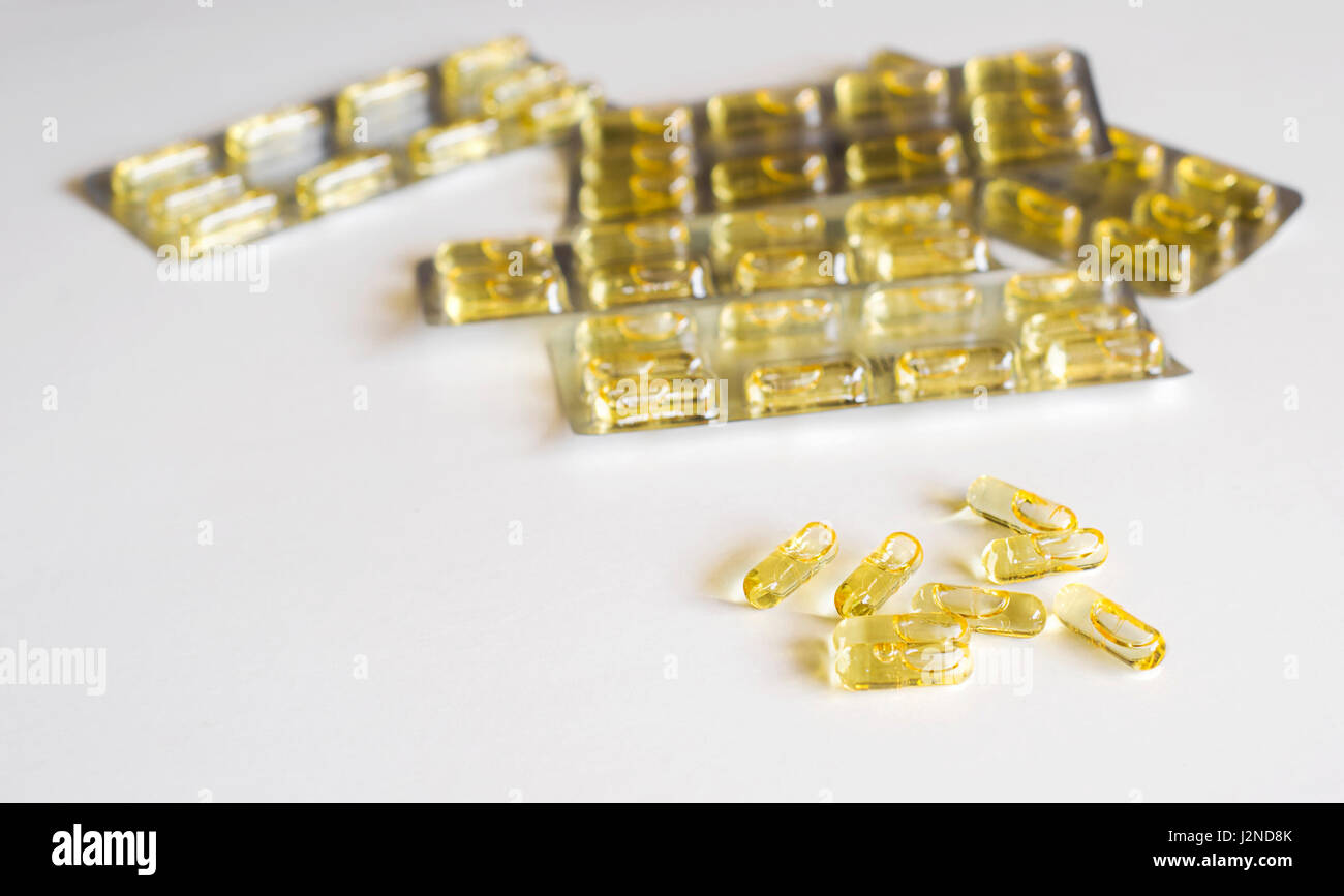 Yellow capsule pills hi-res stock photography and images - Alamy