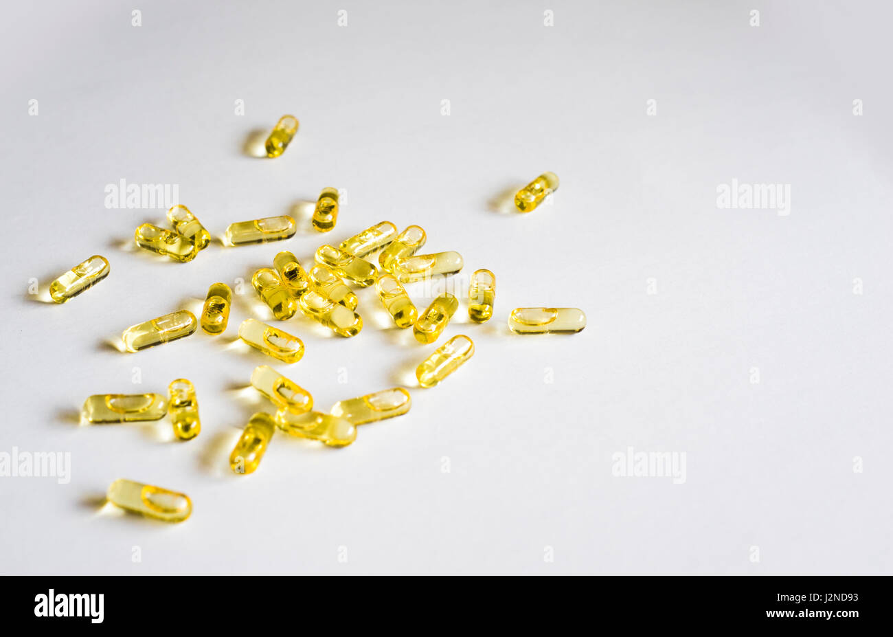 Yellow Capsule pills use in pharmaceutical manufacturing, drug ...