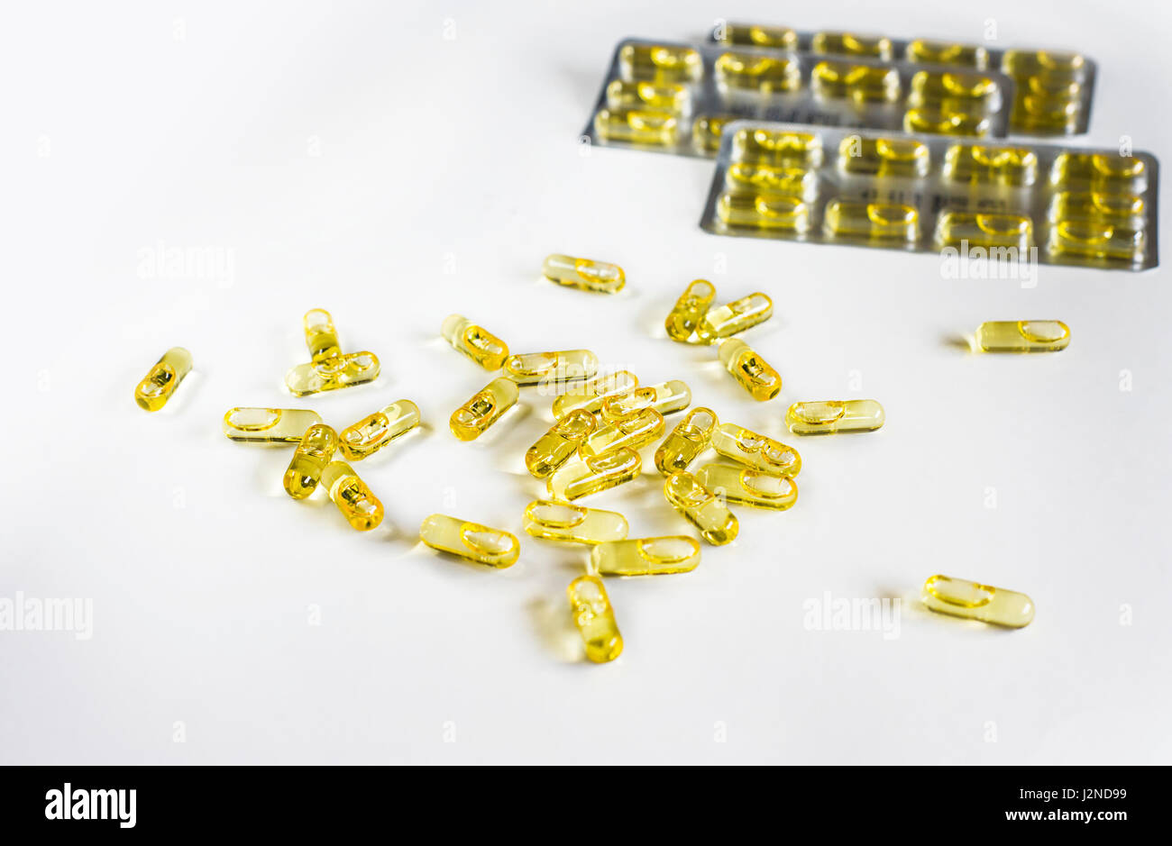 Yellow Capsule pills and package use in pharmaceutical manufacturing ...