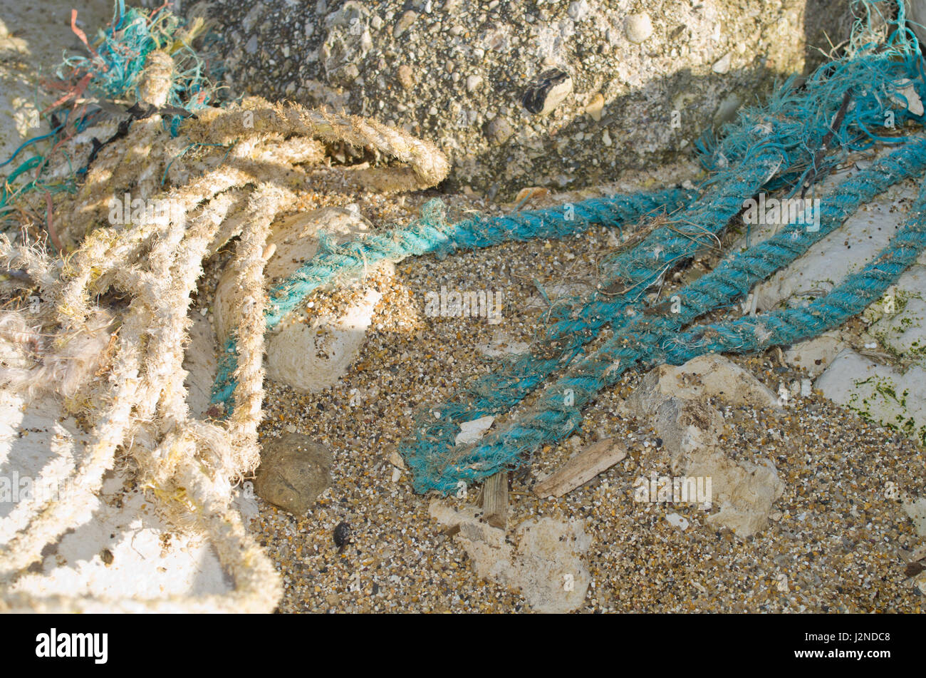 Discarded Blue and White Rope Washed up on beach Stock Photo - Alamy