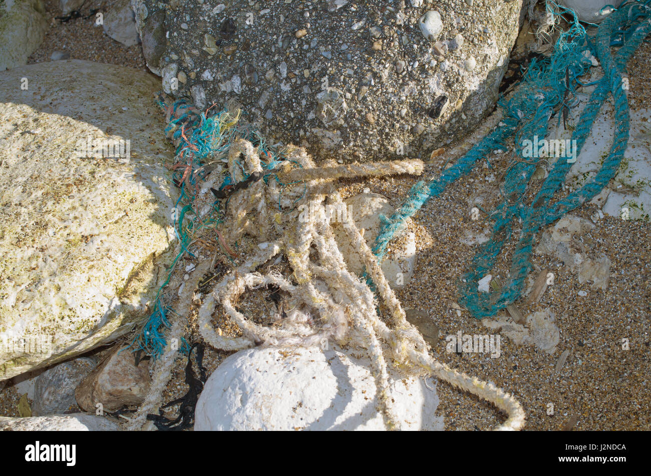 Discarded Blue and White Rope Washed up on beach Stock Photo - Alamy