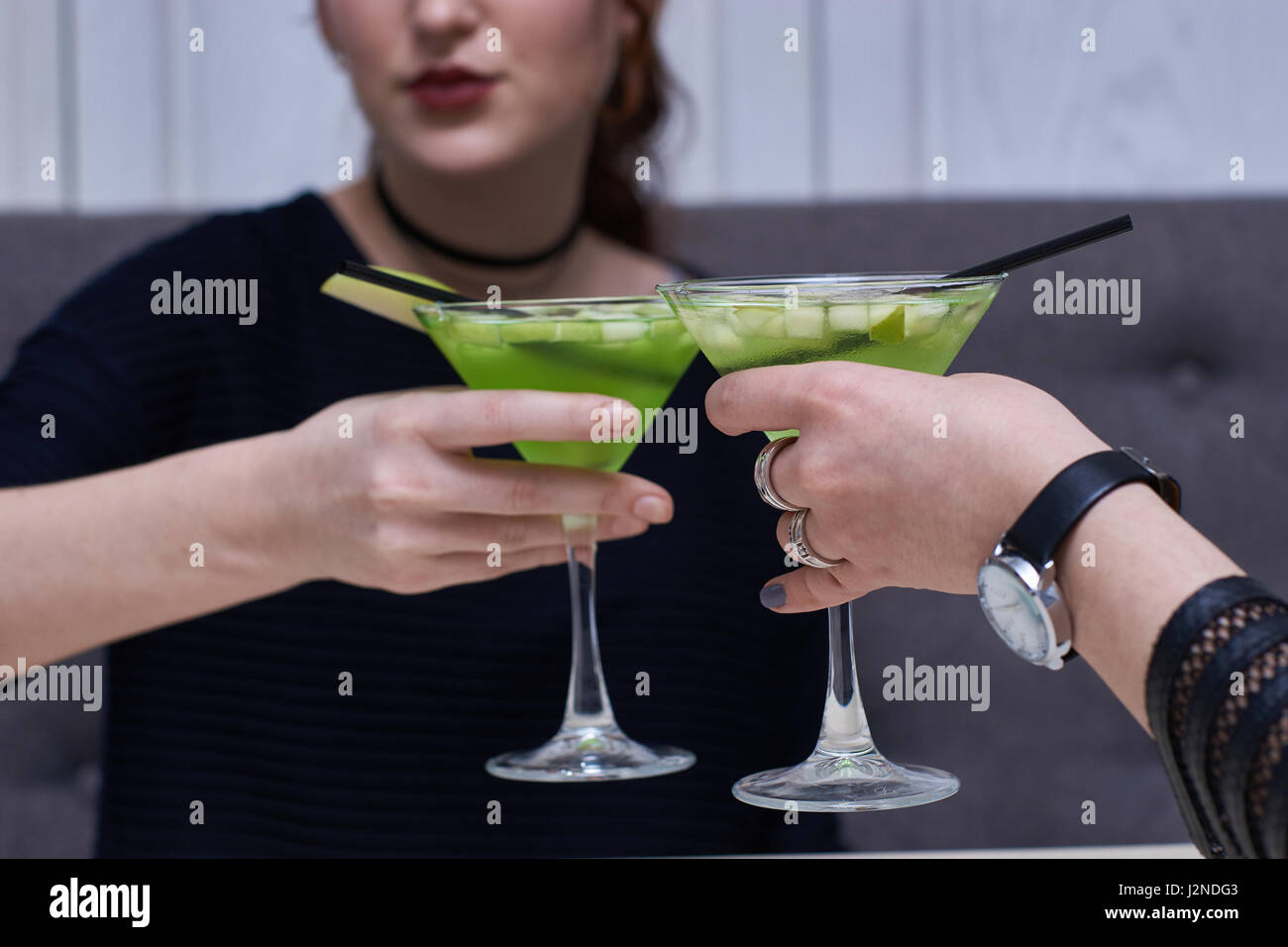 Two glasses of apple martini Stock Photo - Alamy