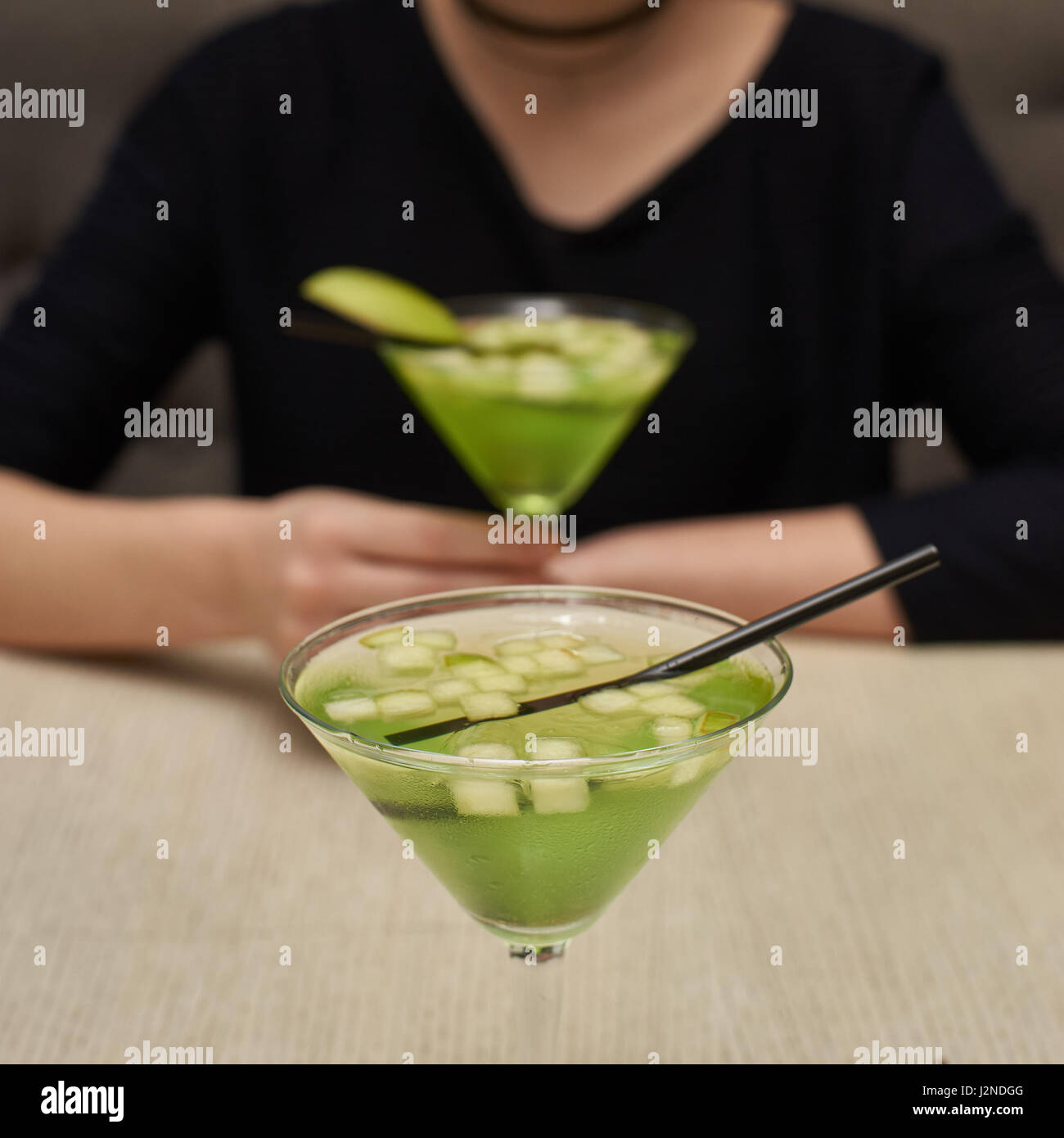 Two glasses of apple martini Stock Photo - Alamy