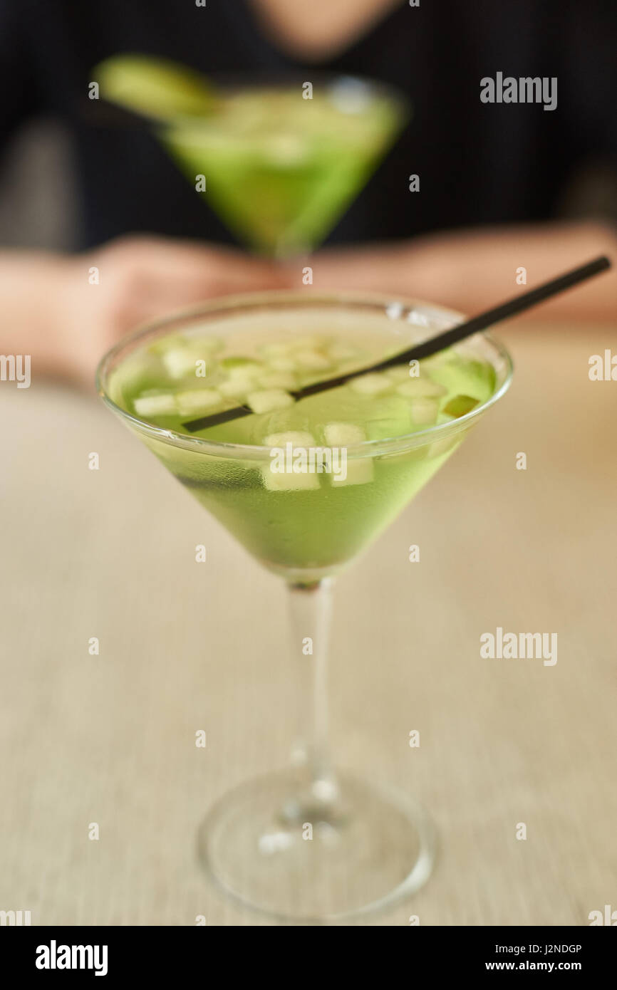 Two glasses of apple martini Stock Photo - Alamy