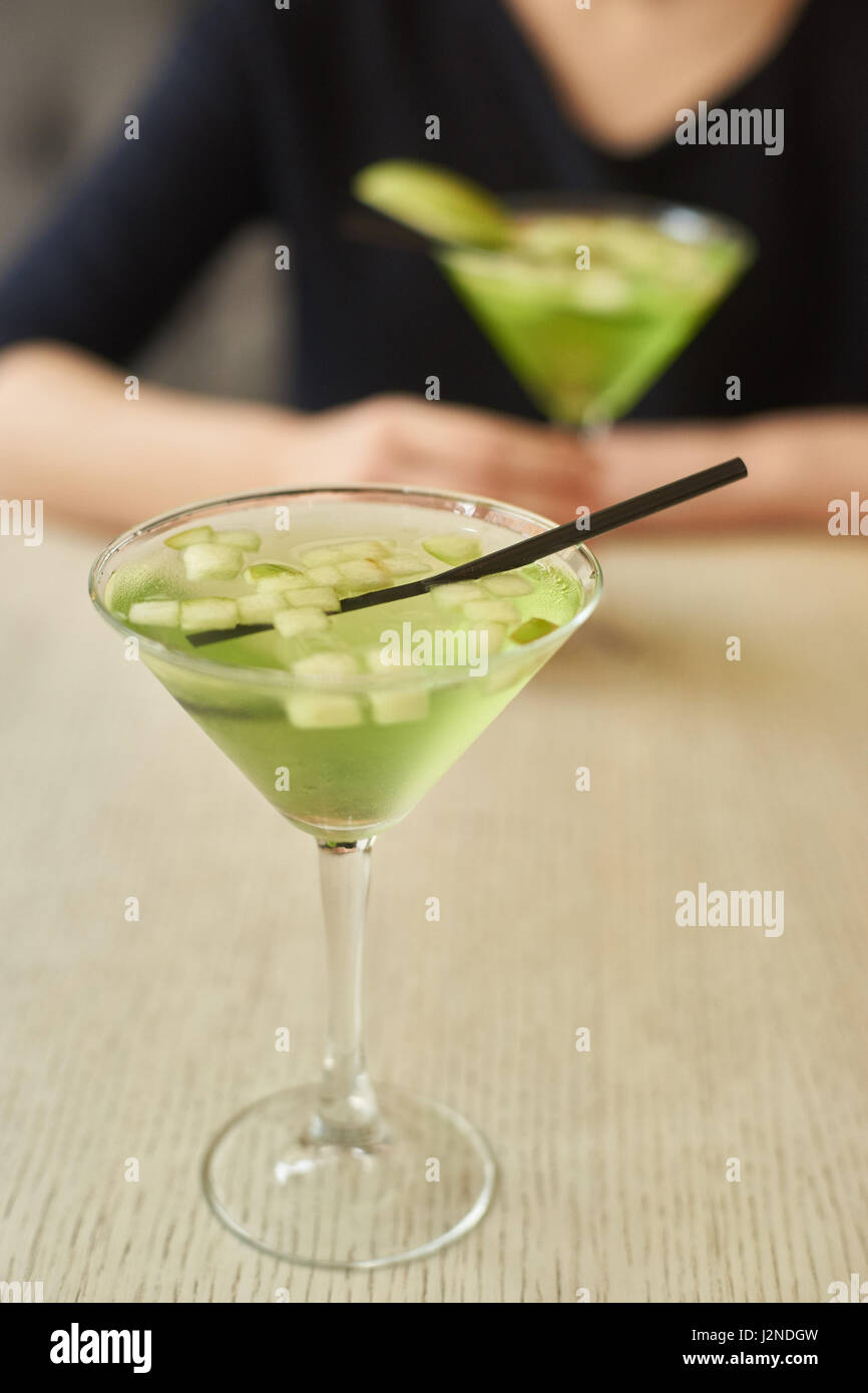 Two glasses of apple martini Stock Photo - Alamy